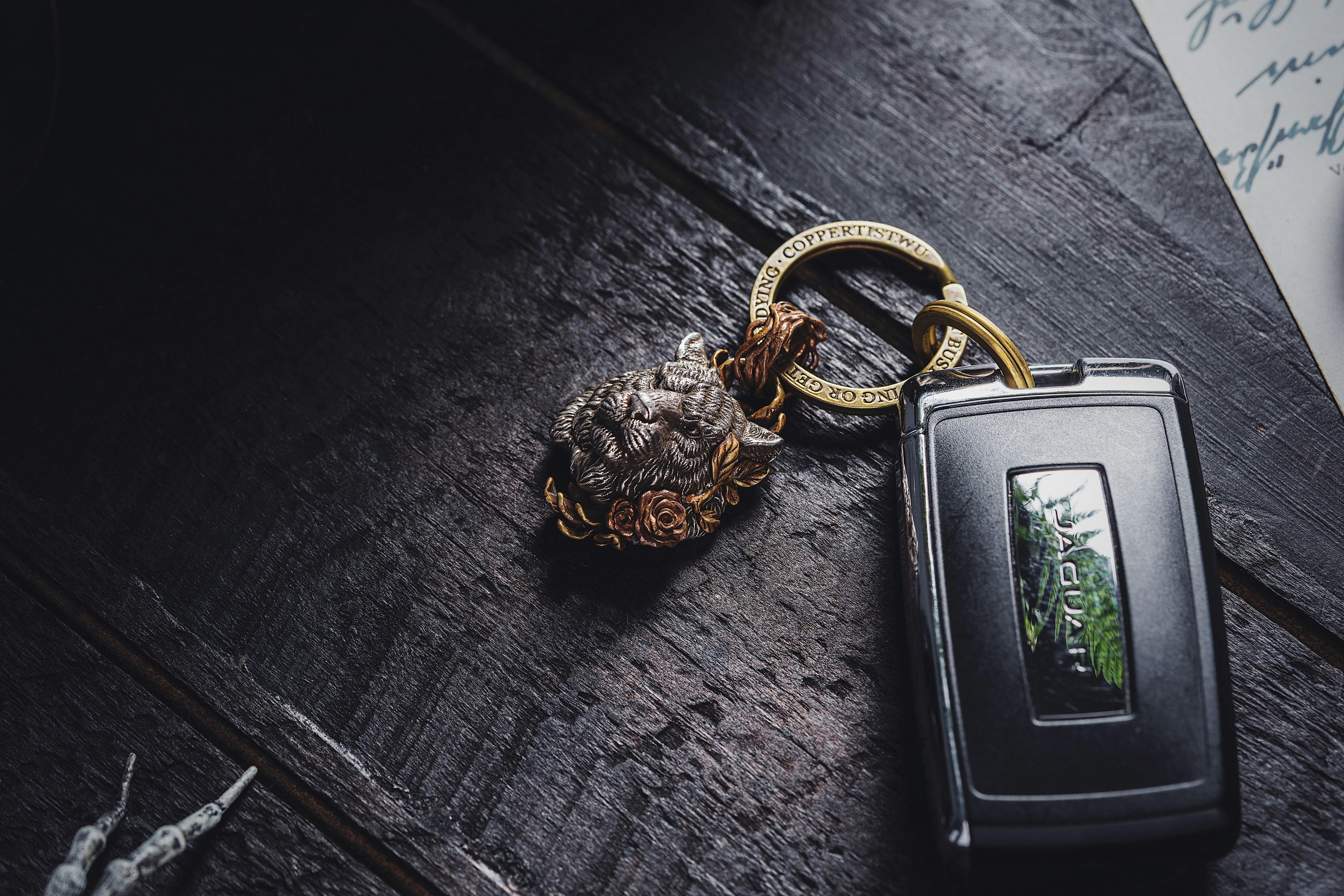 A keychain with a picture of a pine tree on it photo – Free Accessories ...