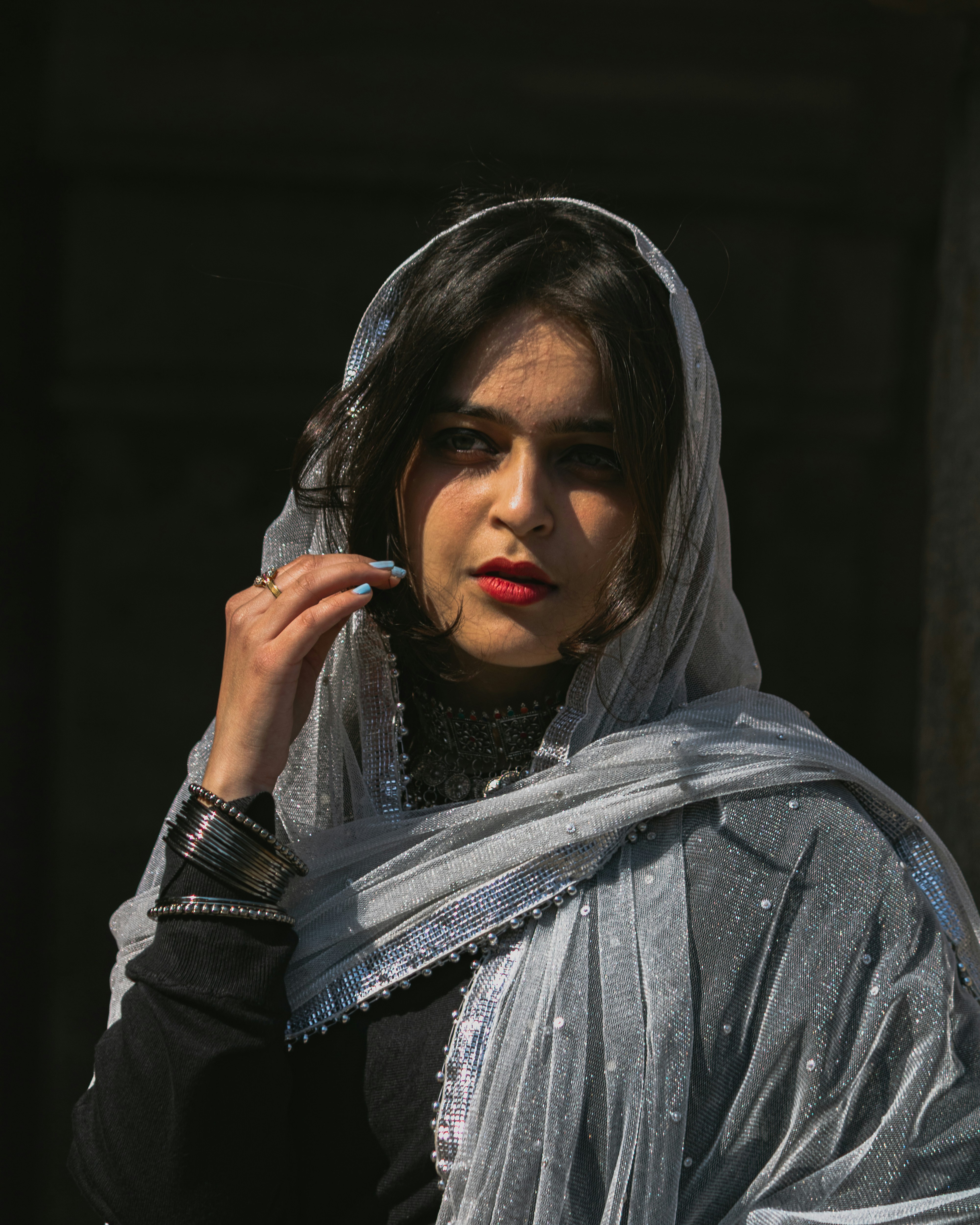 A woman in a veil smoking a cigarette photo – Free Portrait Image on ...
