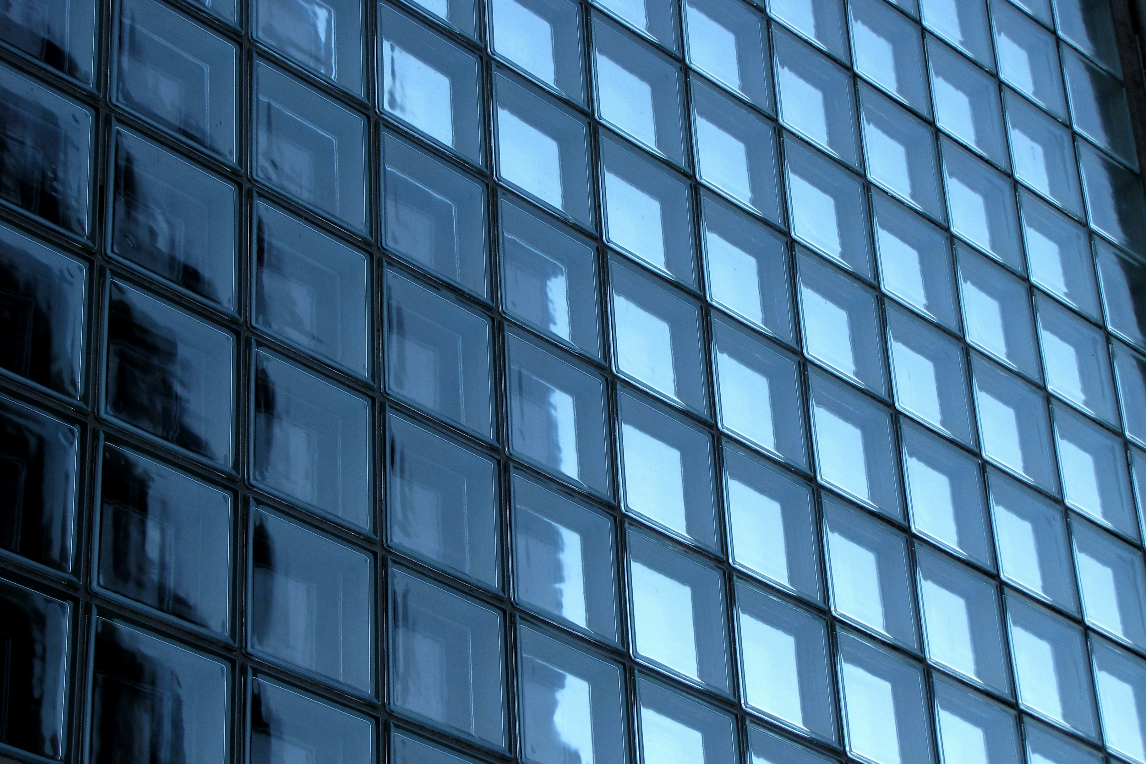 A very tall building with lots of windows photo – Free Blue Image on ...