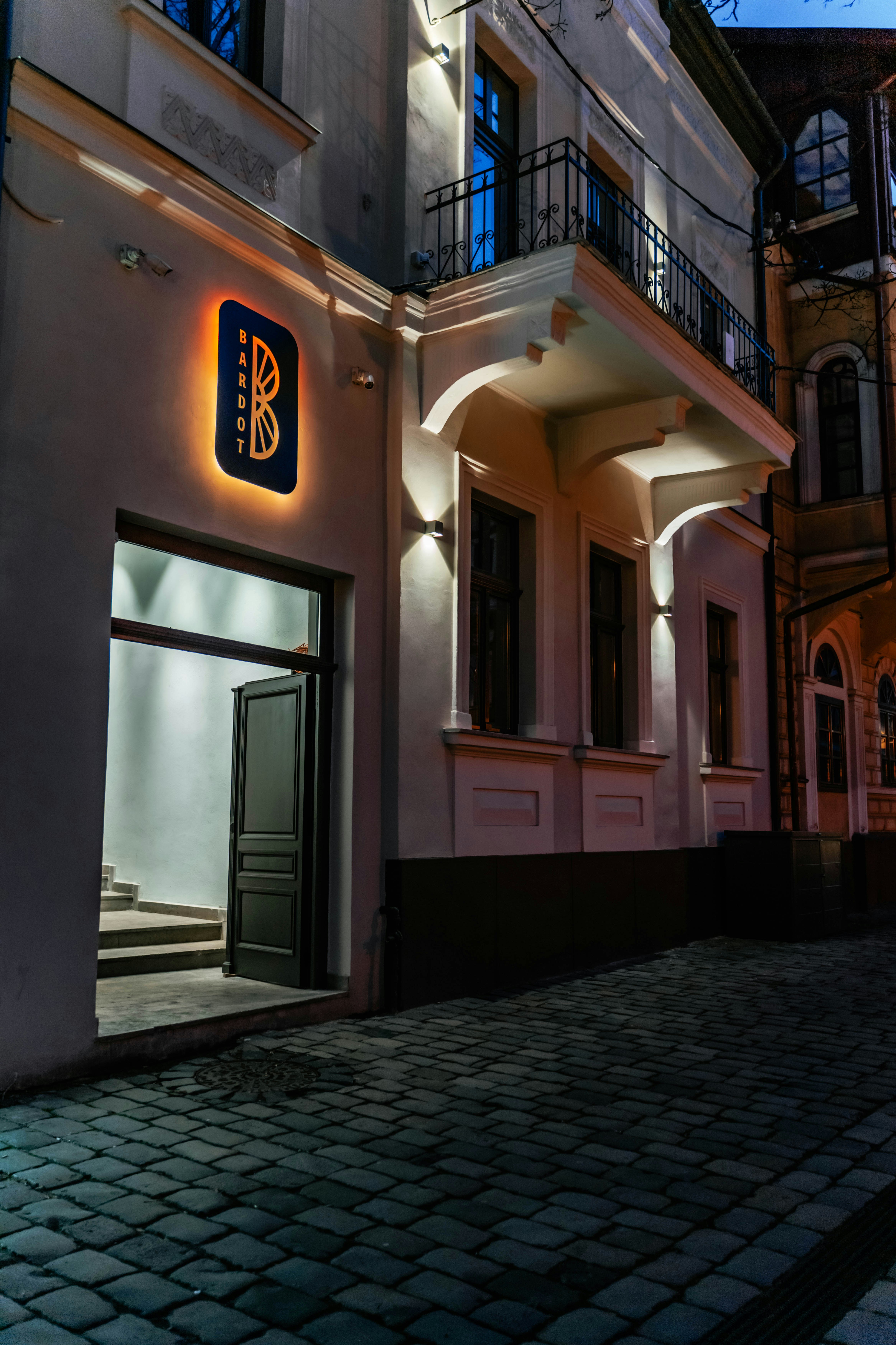 a building with a lit up sign on the side of it