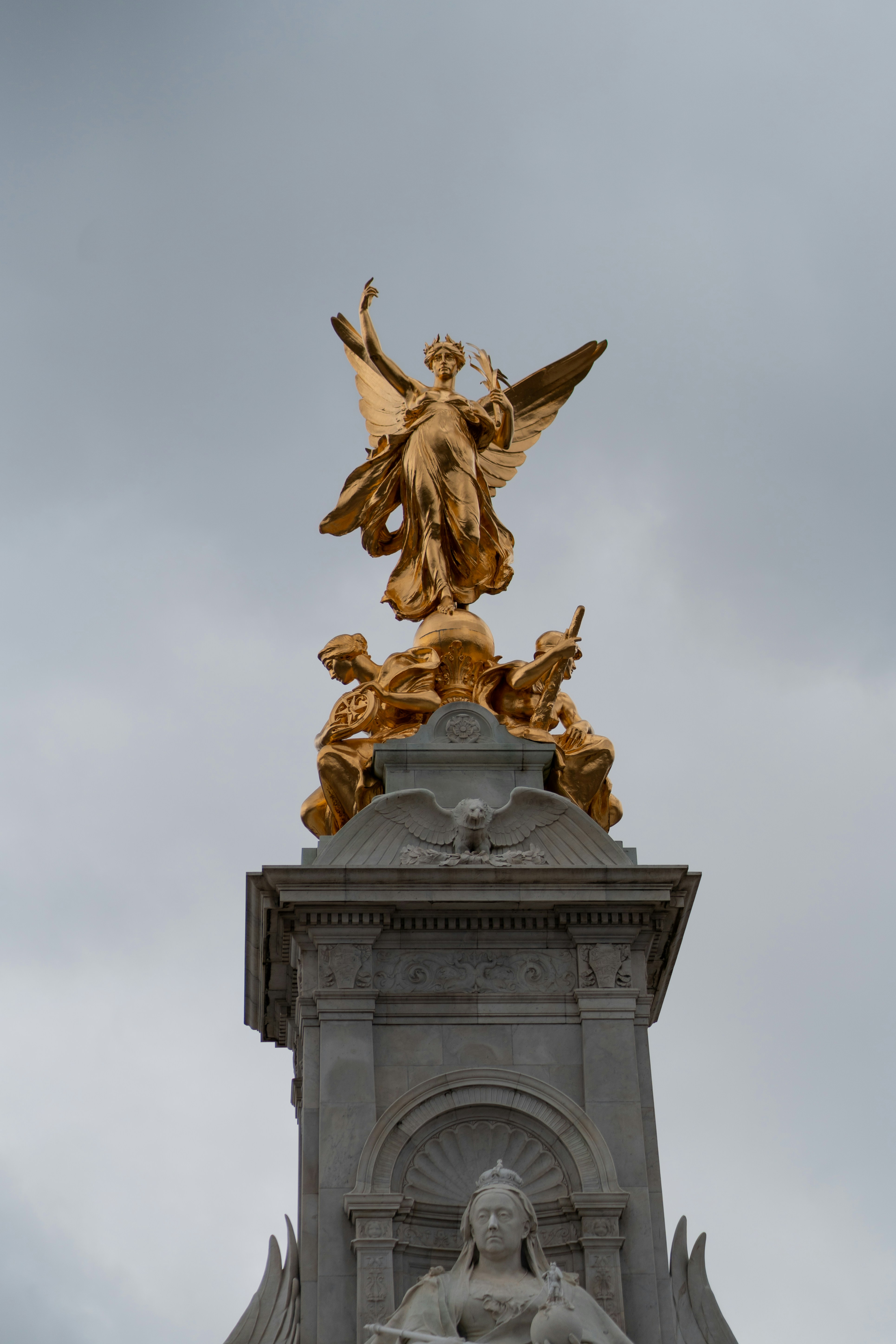A statue of an angel on top of a building photo – Free Image on Unsplash