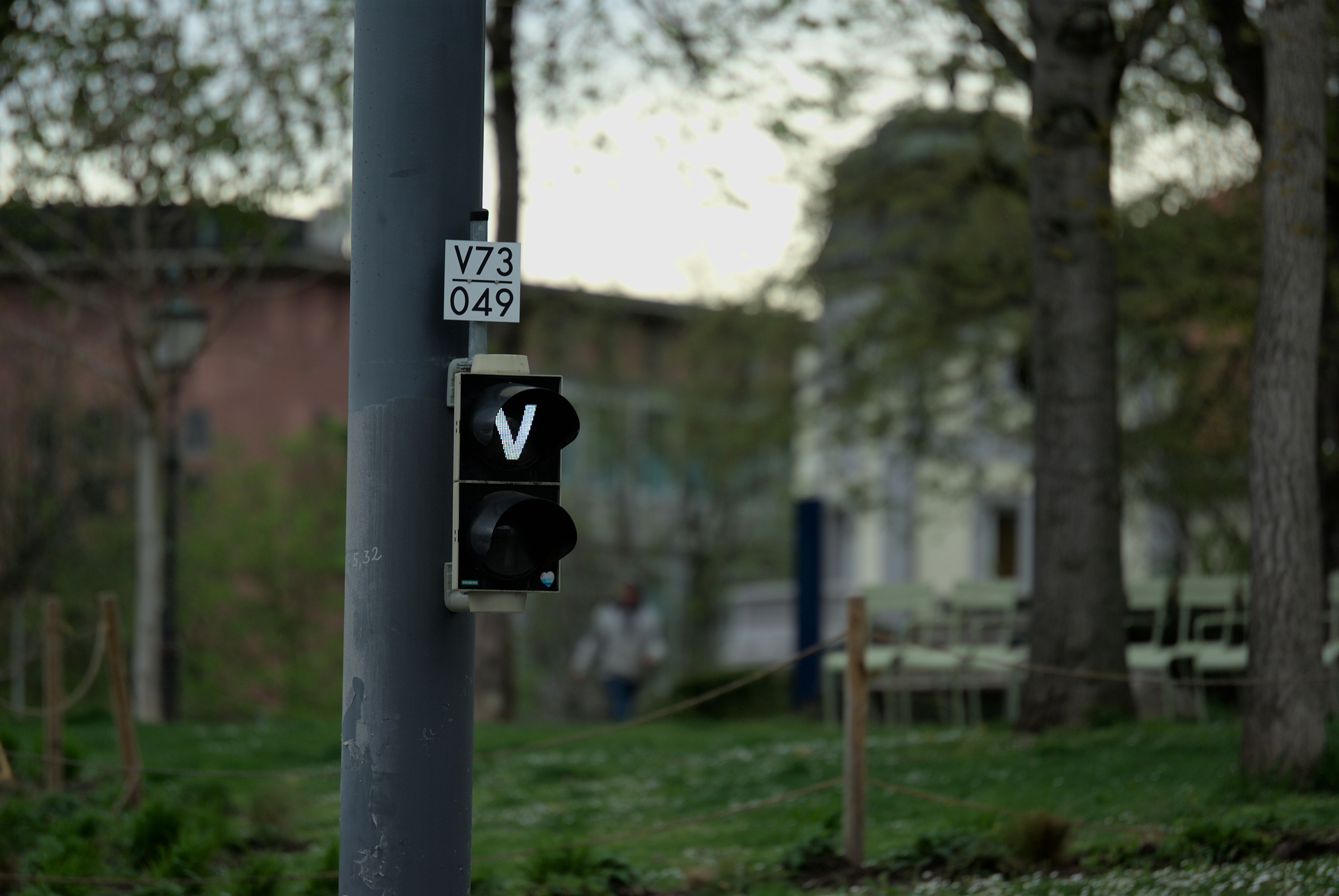 V-Tagged Traffic Signal at the Edge of a Quiet Park