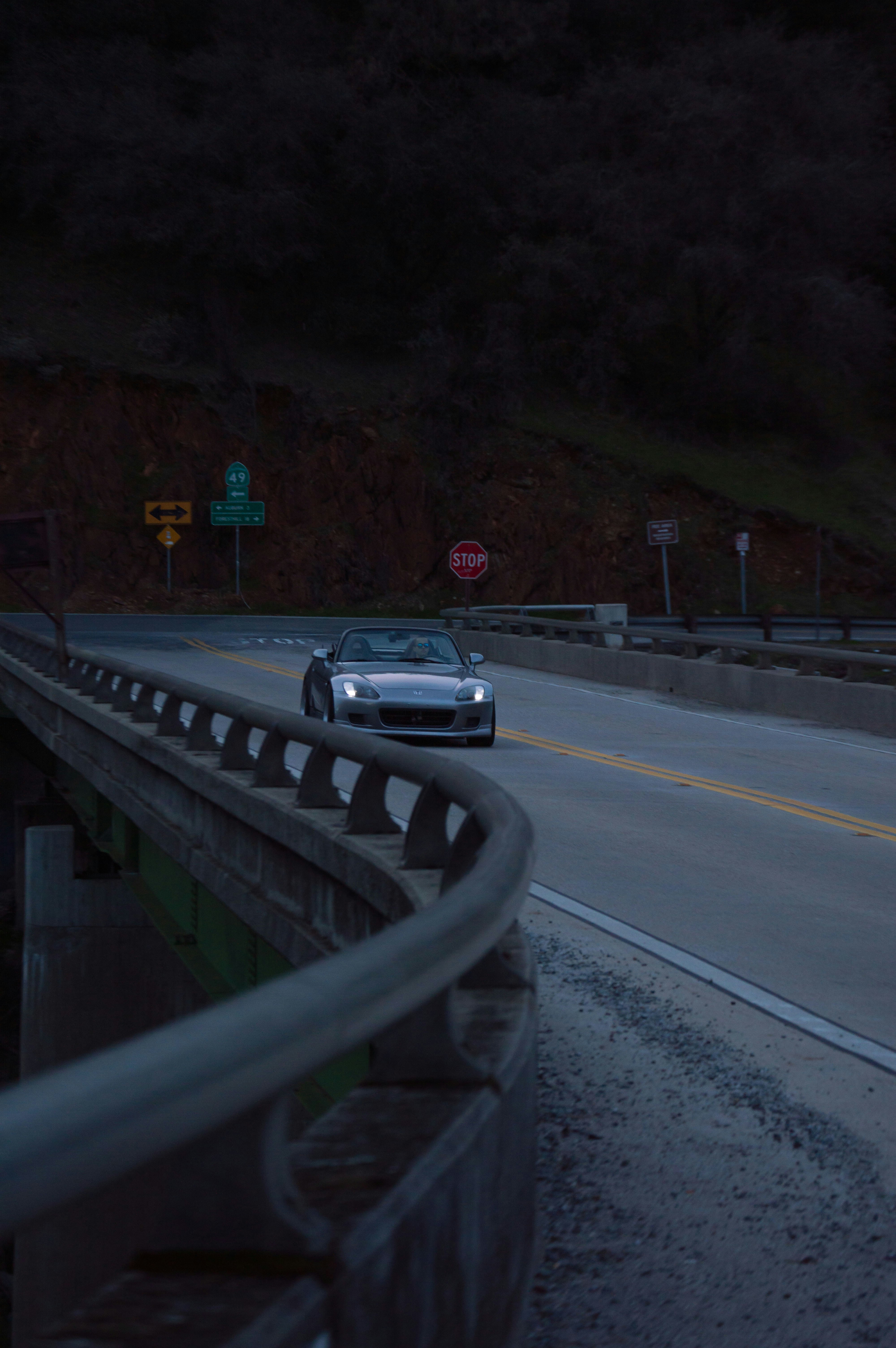 Midnight Convertible on the Distant Bridge