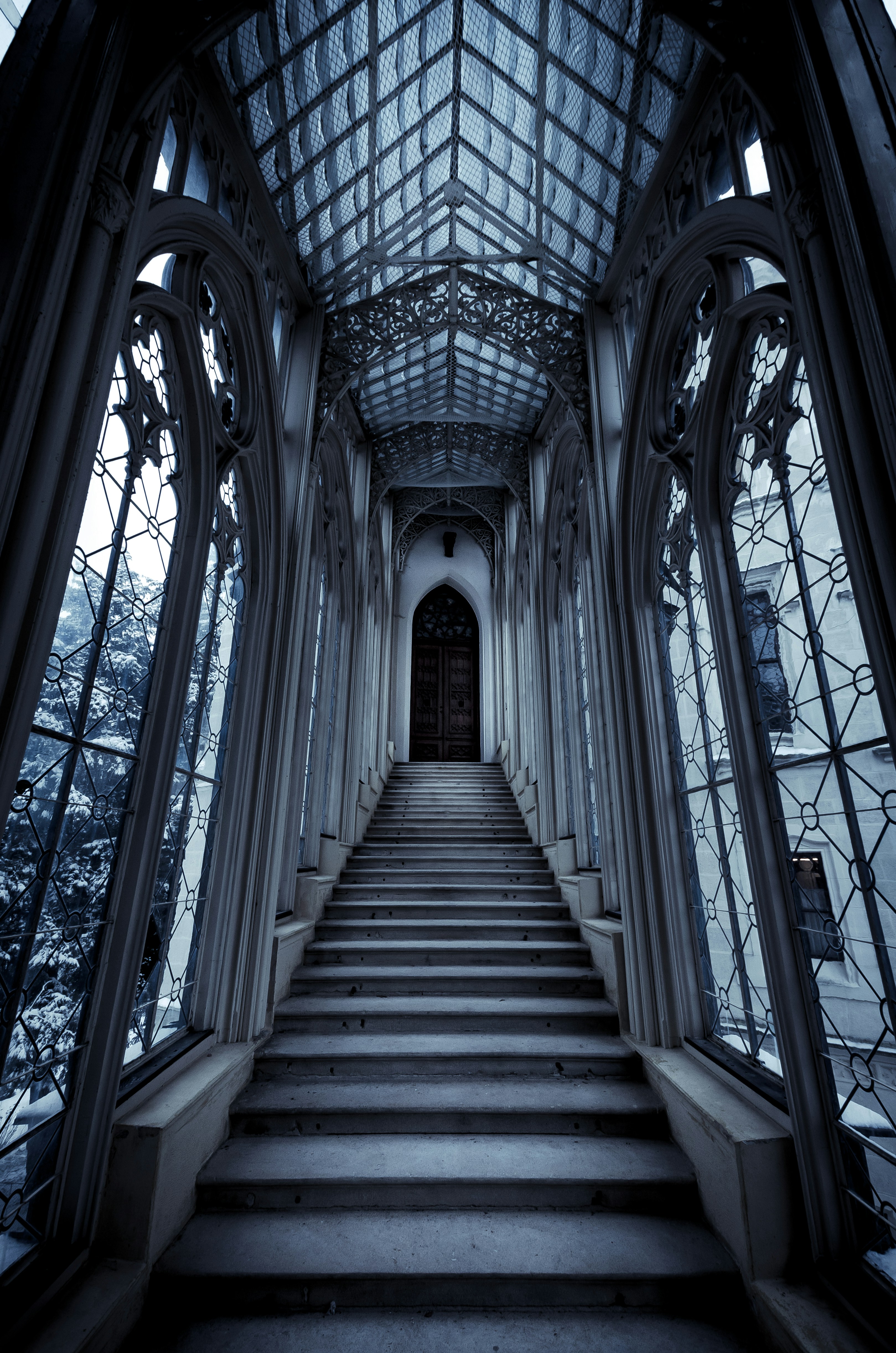 A set of stairs leading up to a large window photo – Free Staircase ...