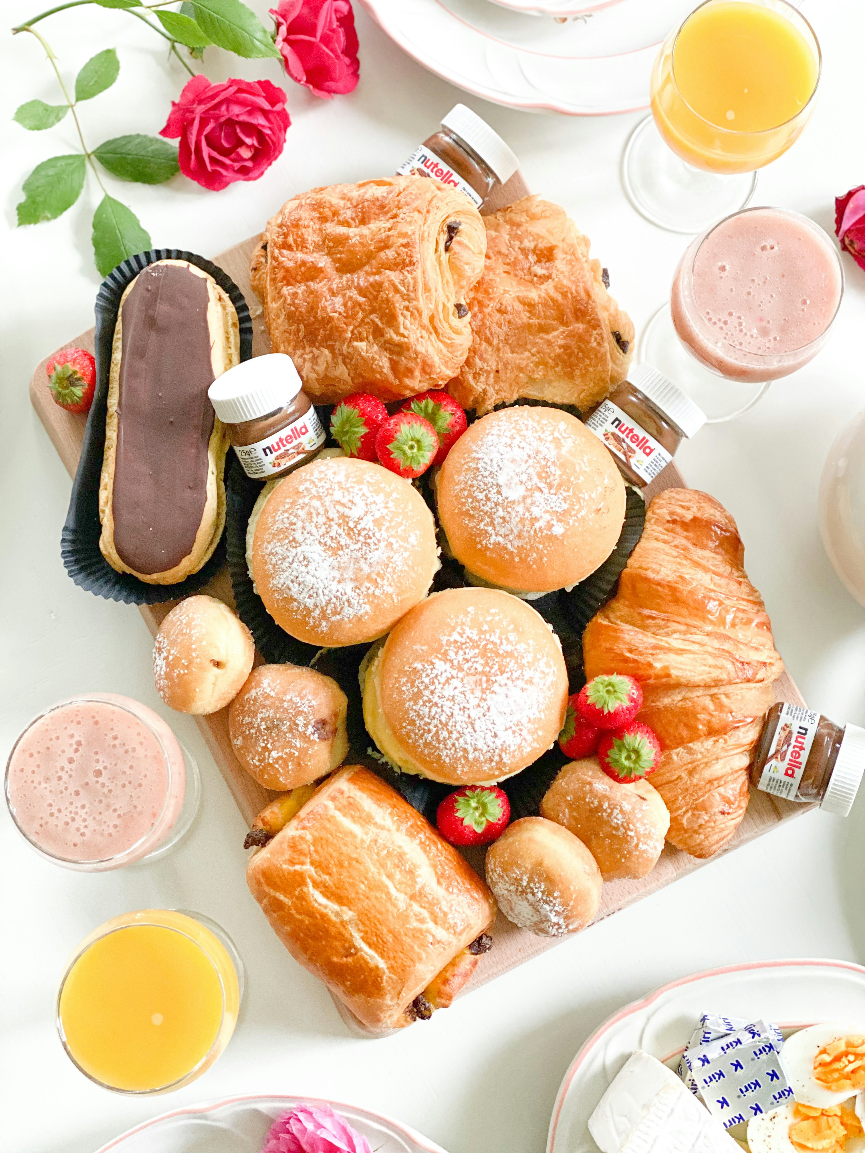A white table topped with pastries and fruit photo – Free Food Image on ...