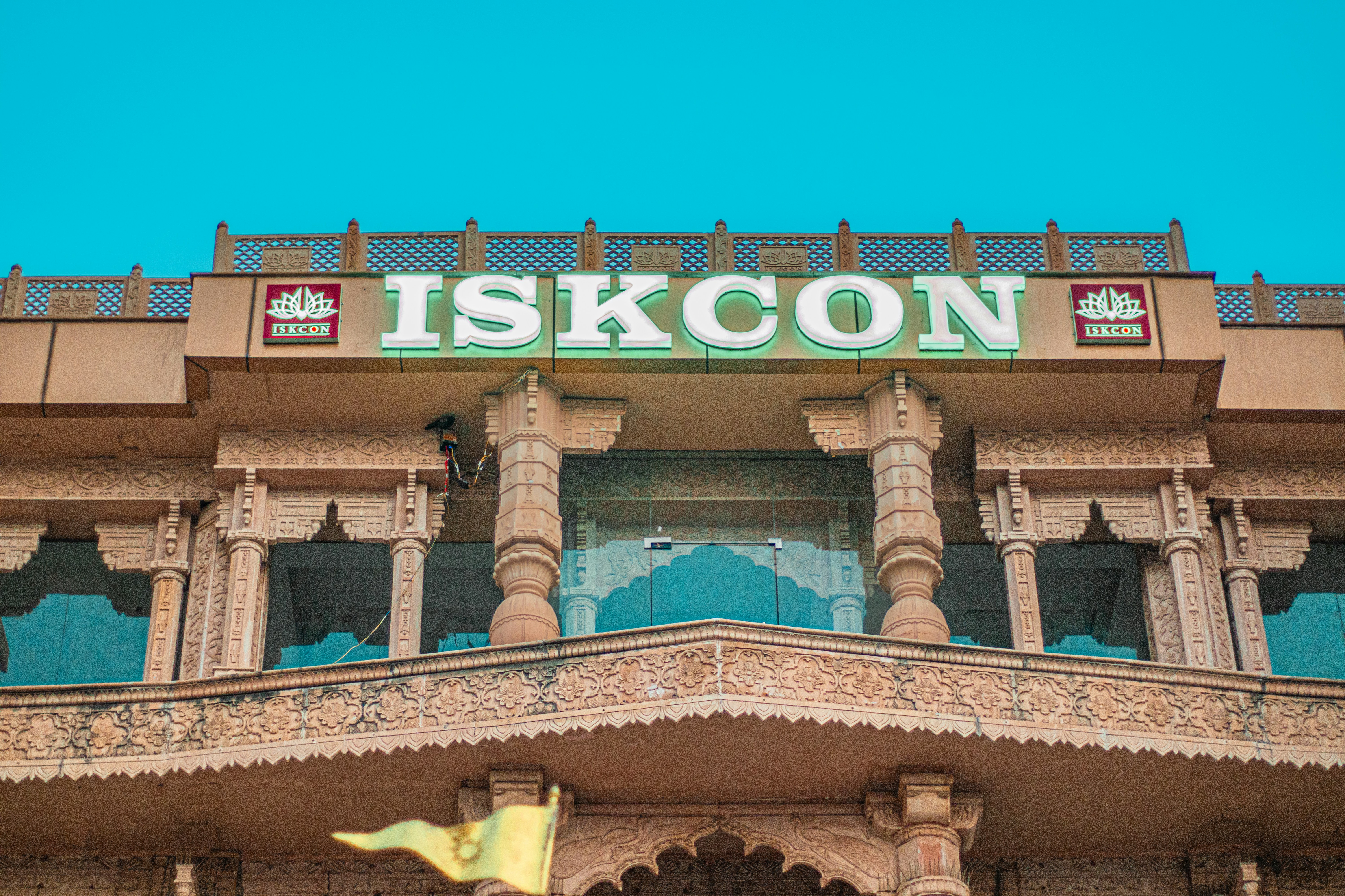 A building with a sign that says iskcon on it photo – Free Building ...