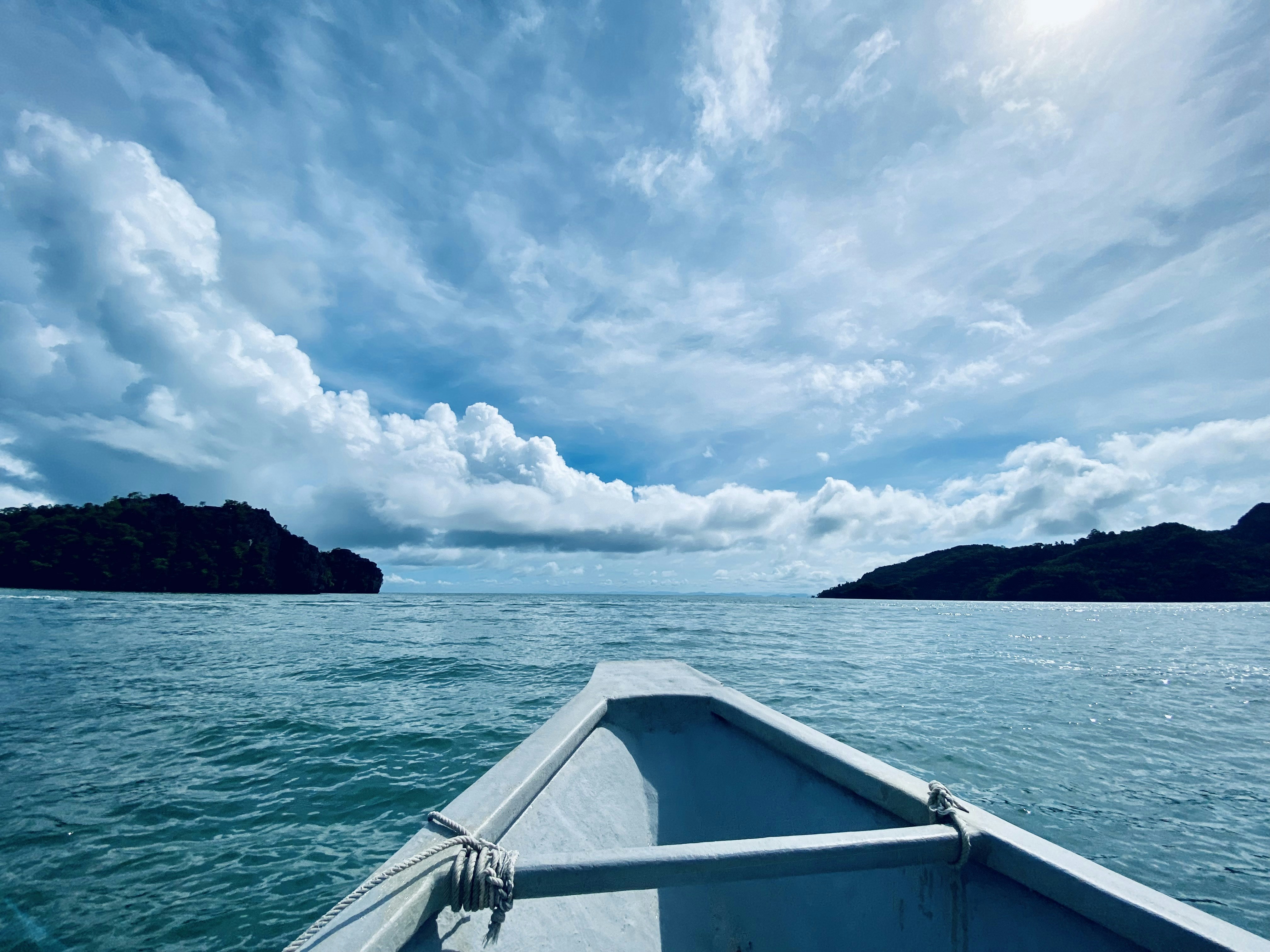 A boat traveling across a large body of water photo – Free Sea Image on ...