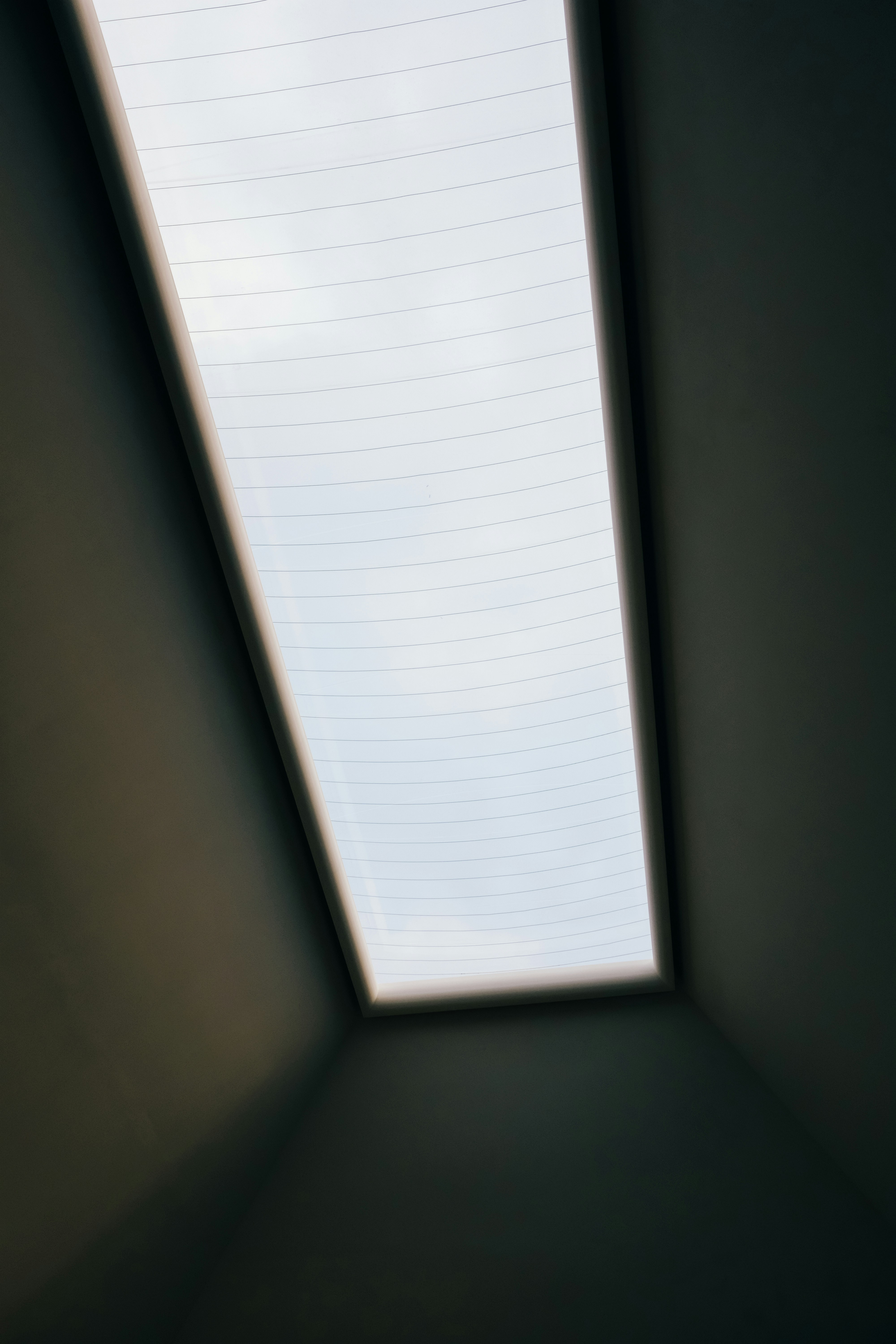 A room with a skylight and a white wall photo – Free Skylight Image on ...