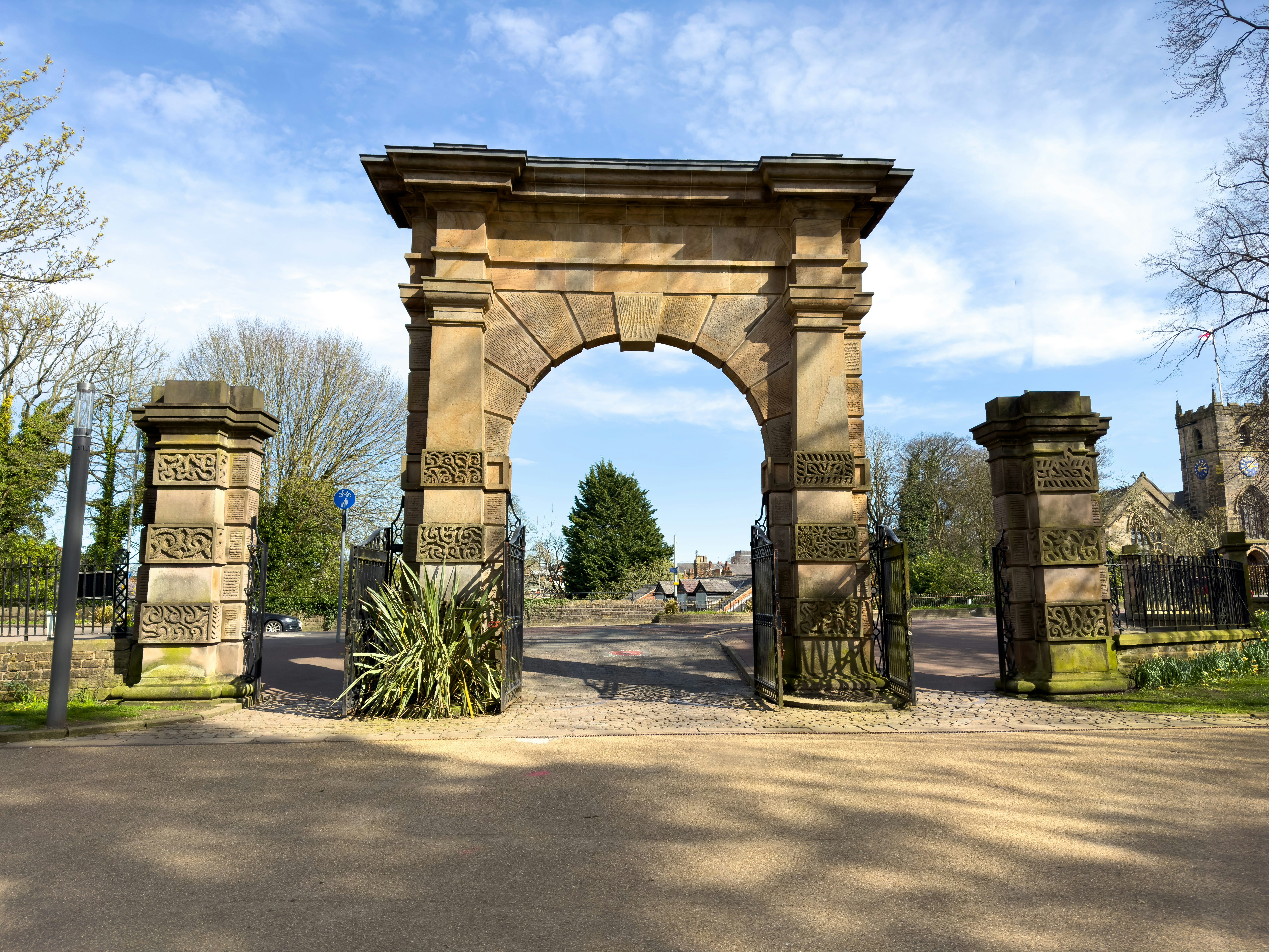 A large stone arch in the middle of a road photo – Free Chorley Image ...