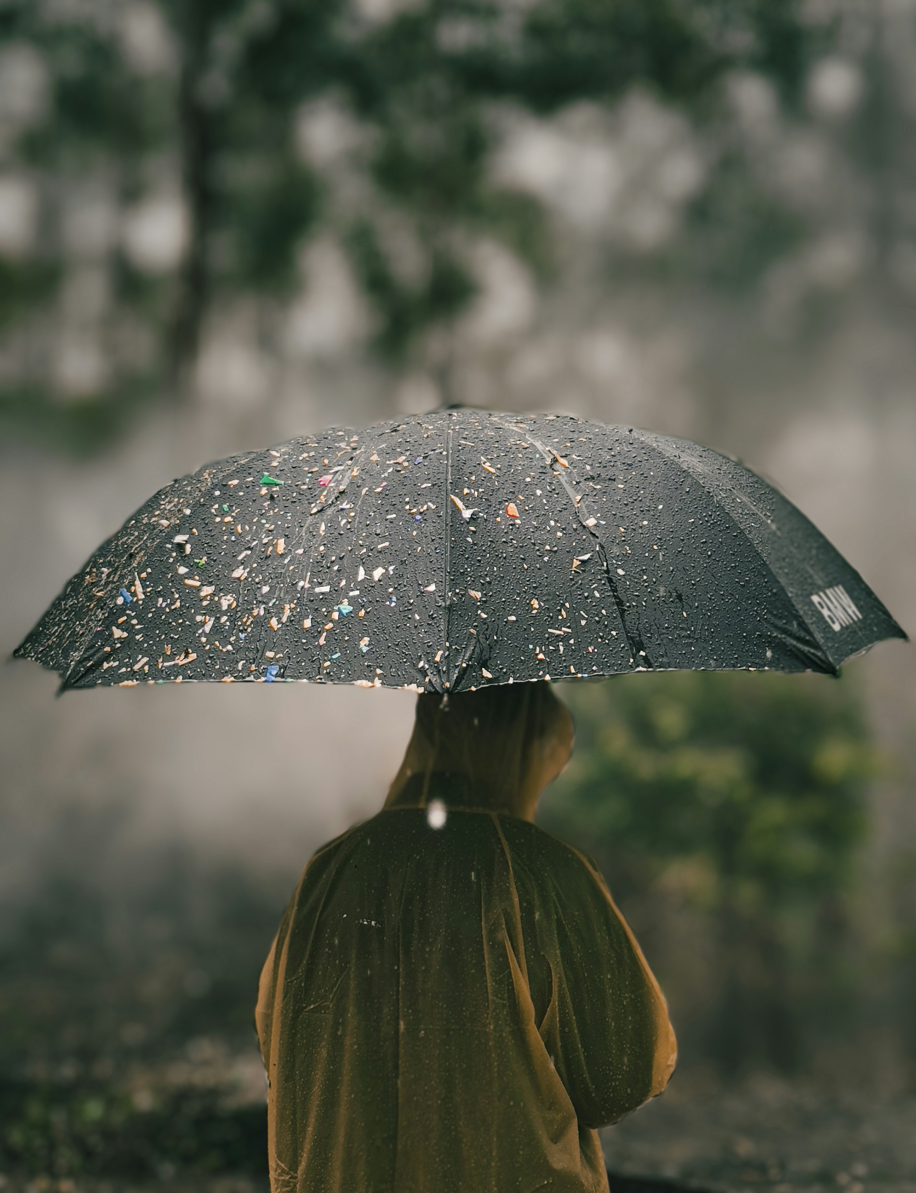 A person standing under an umbrella in the rain photo – Free China ...