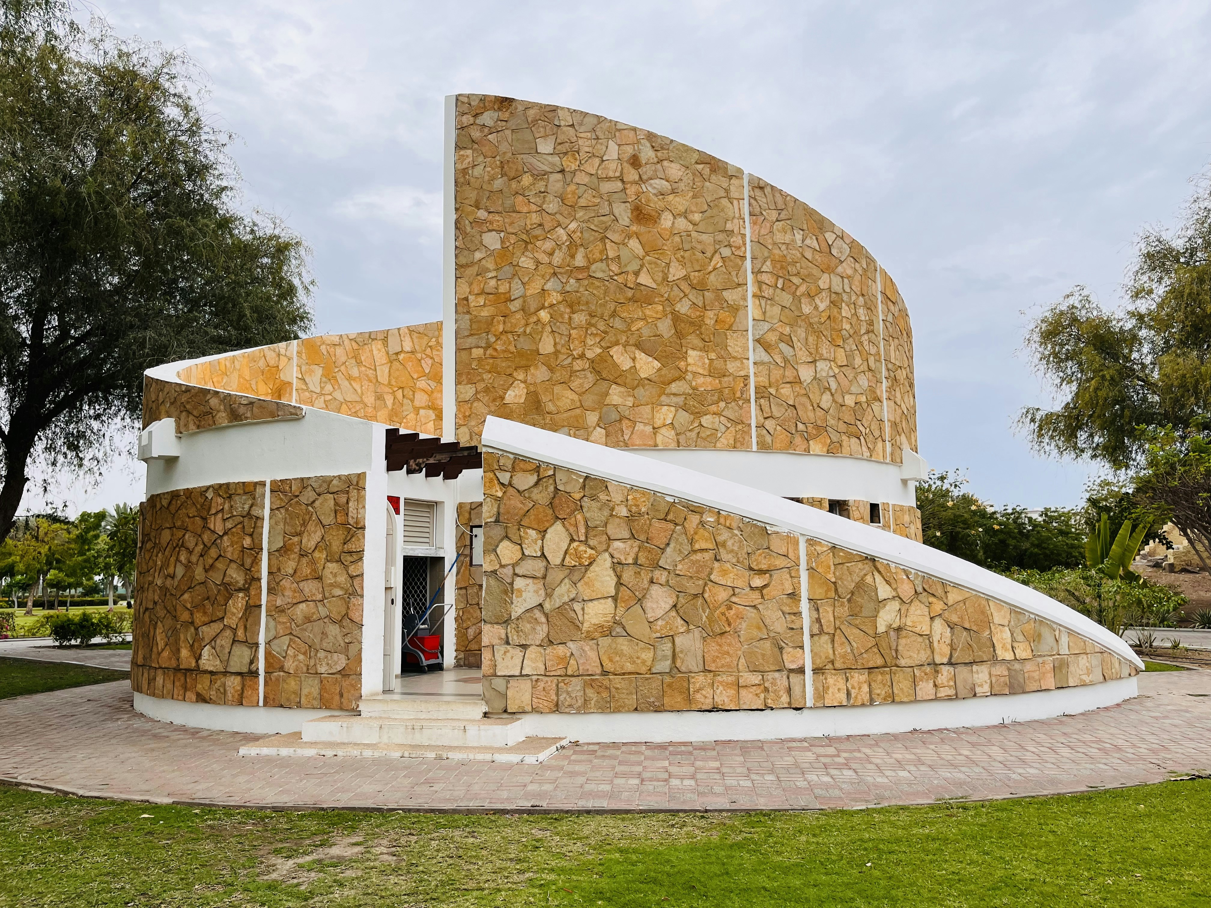 A building made out of rocks with a spiral staircase photo – Free Oman ...