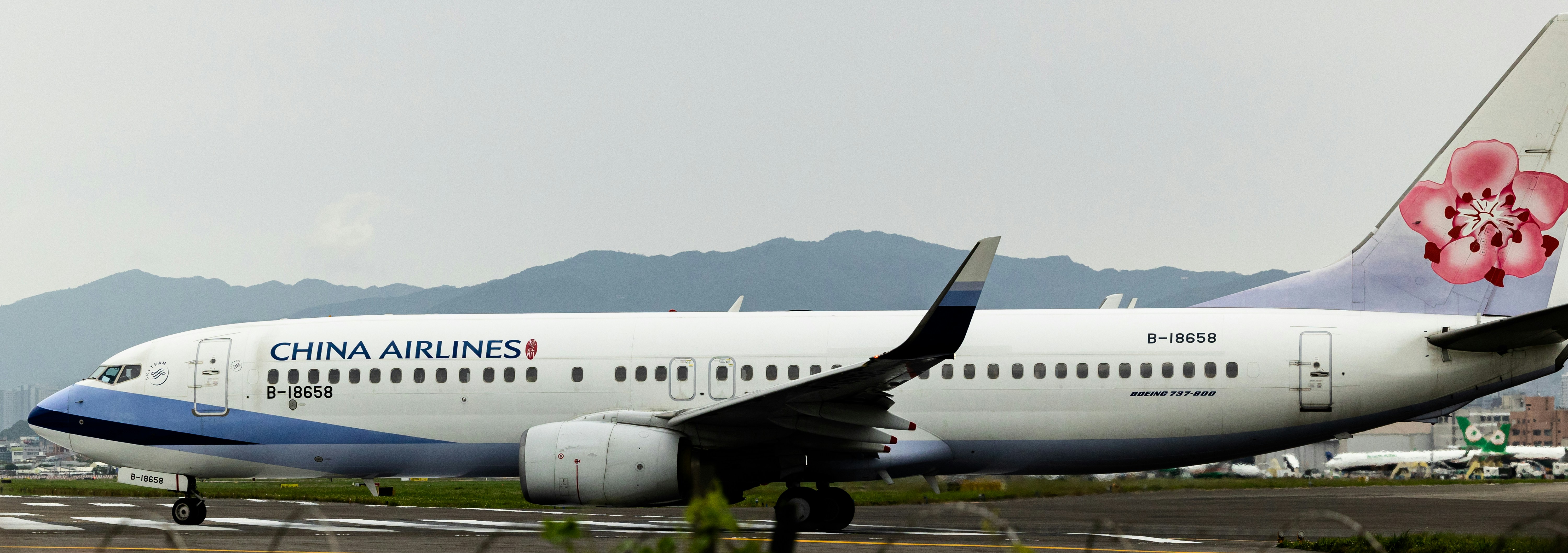 A china airlines airplane on the runway at an airport photo – Free ...