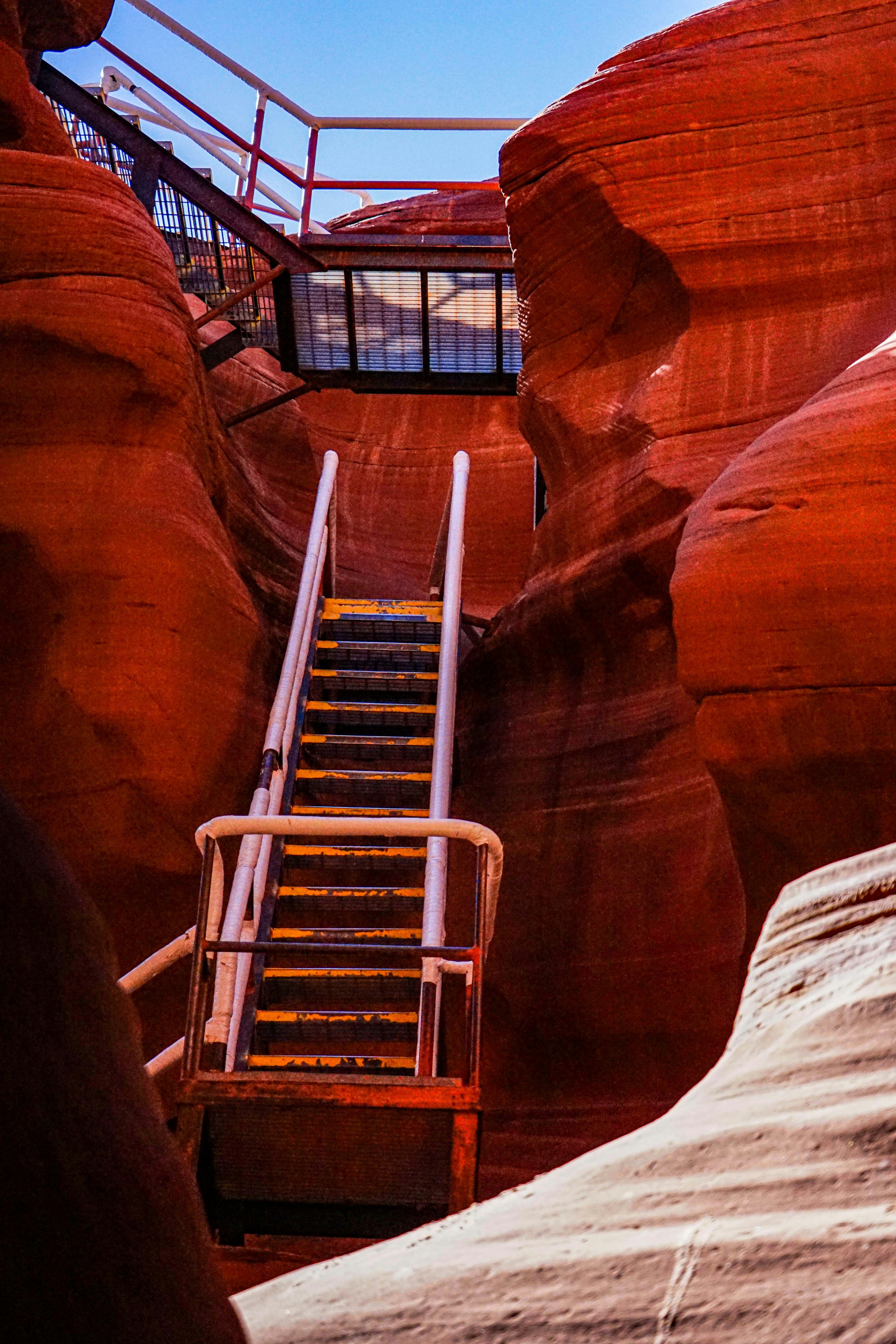 A set of stairs leading up to the top of a cliff photo – Free Lower ...