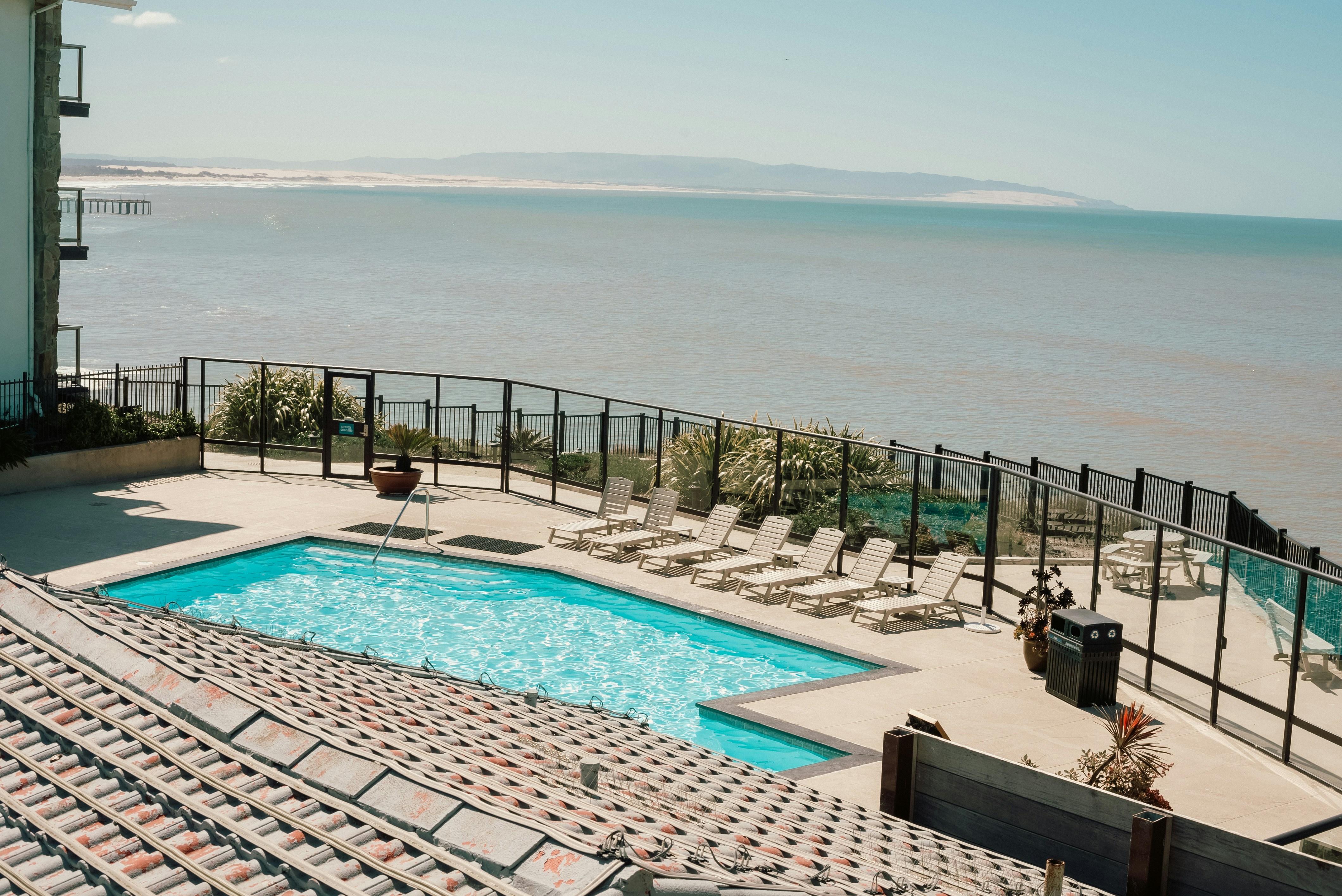 A view of a swimming pool from a balcony photo – Free California Image ...