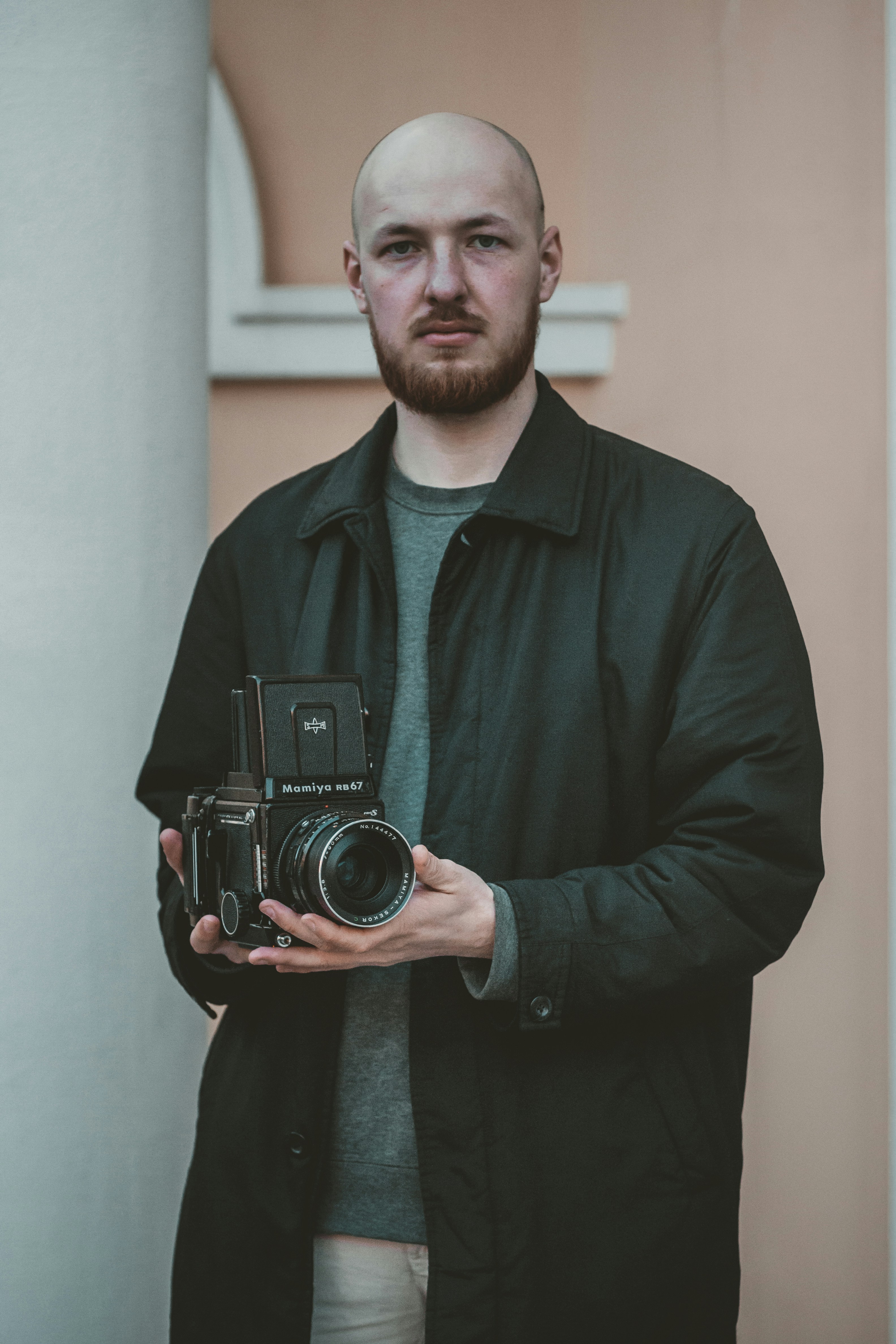 Between Columns and a Vintage Mamiya: A Quiet Portrait