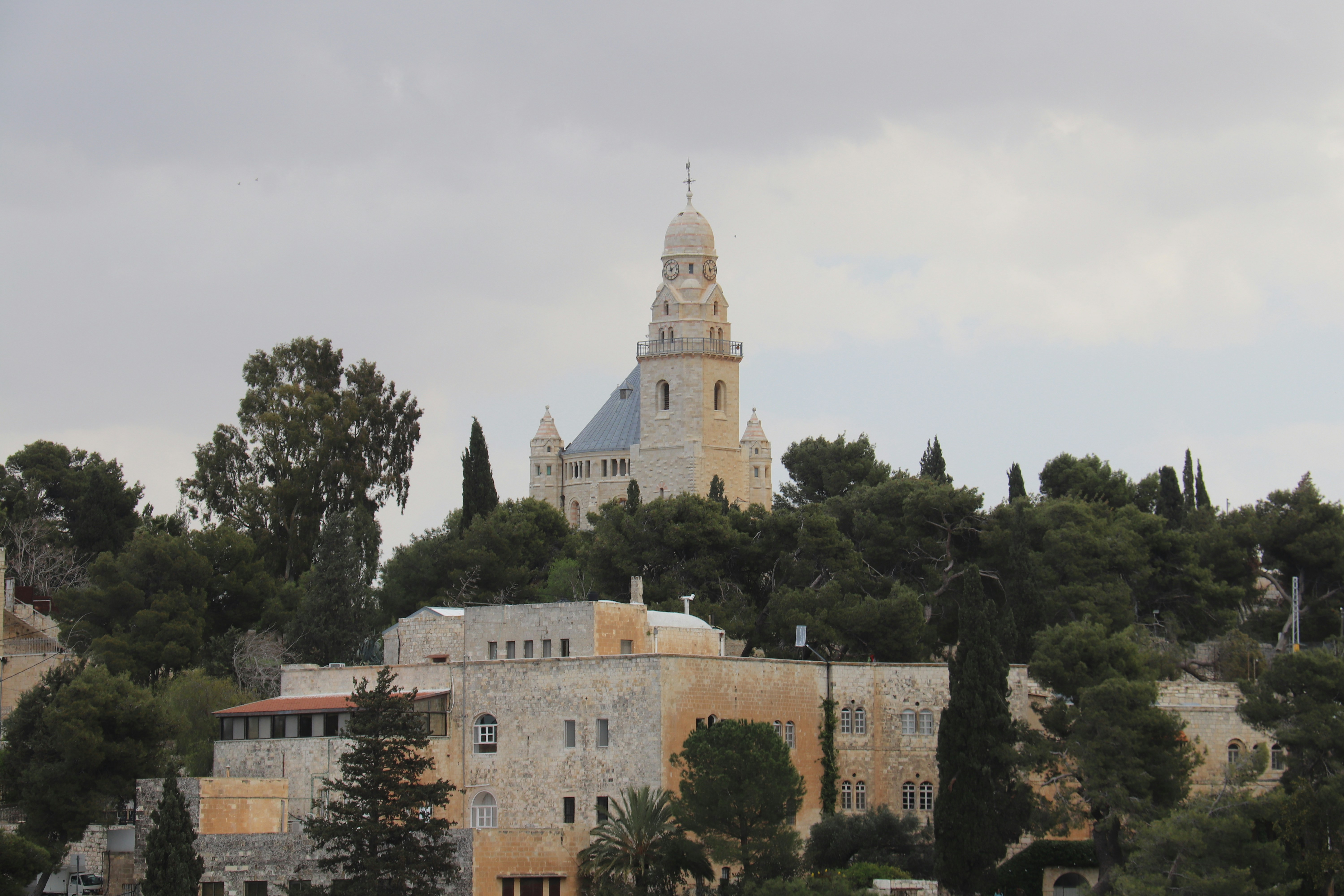 A large building with a steeple on top of a hill photo – Free Building ...