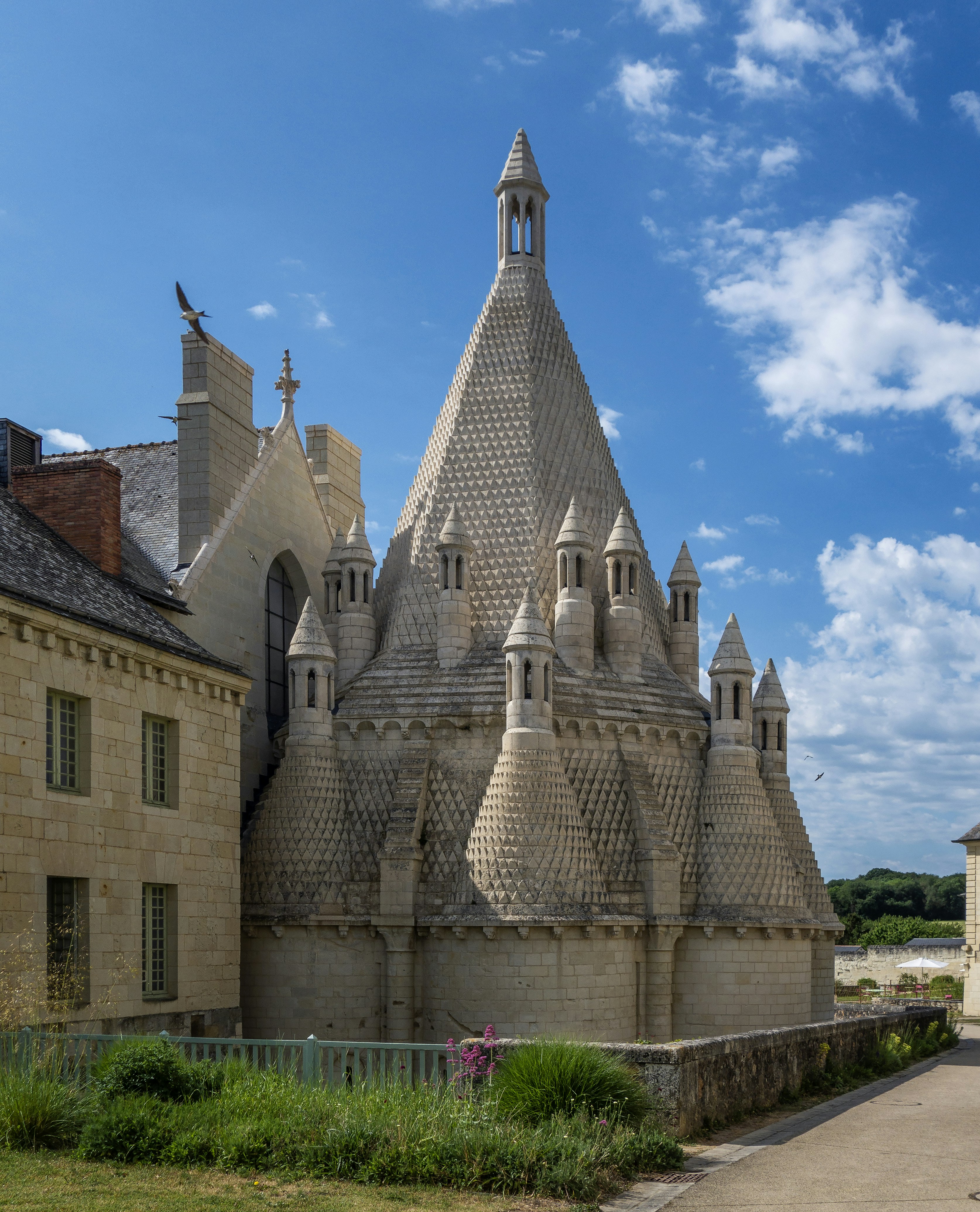A castle like building with a clock tower photo – Free Fontevraud-l ...