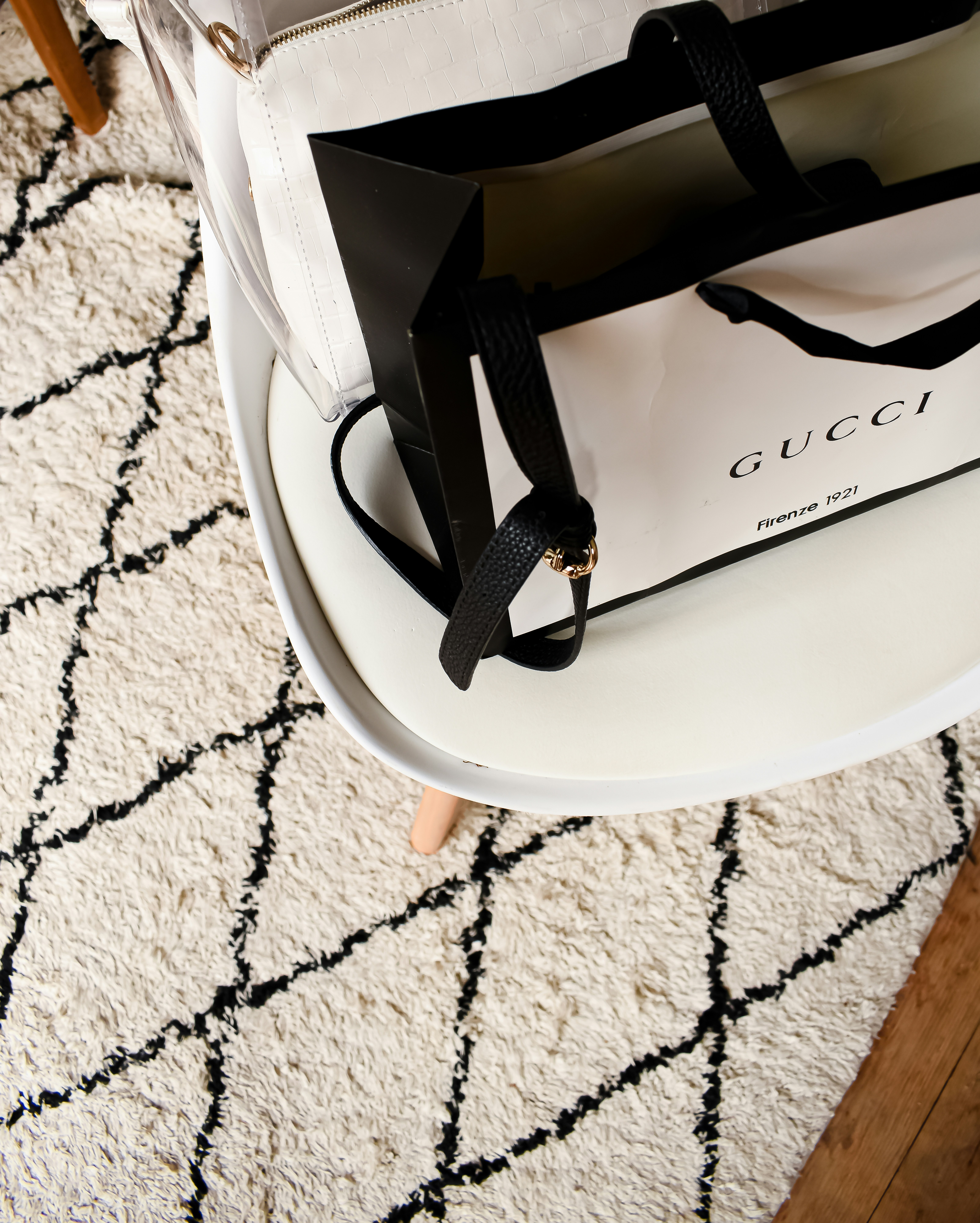 Gucci on the White Chair: Subtle Luxe in a Domestic Corner