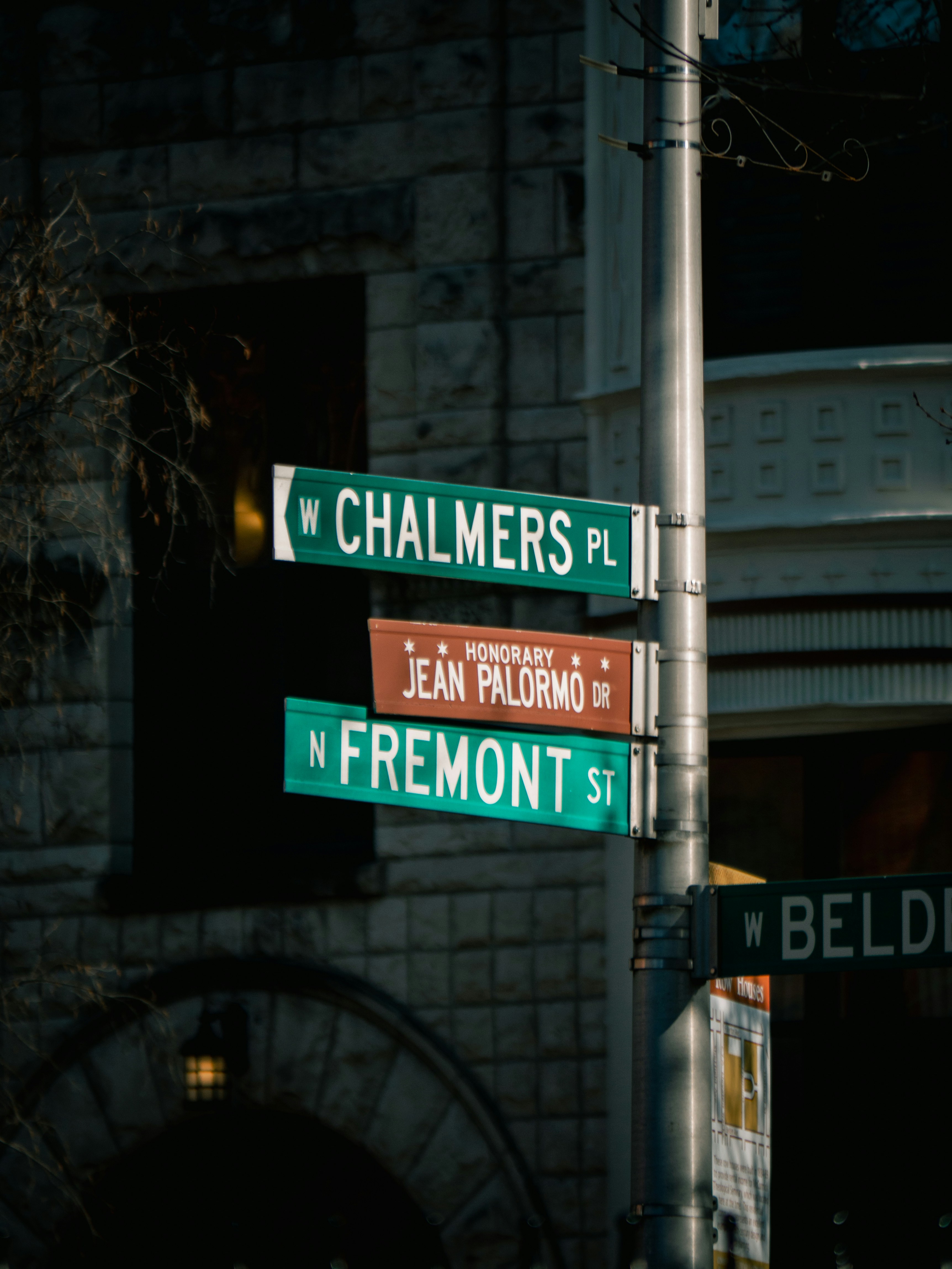 Crossroads of History: Street Signs on a Quiet City Corner