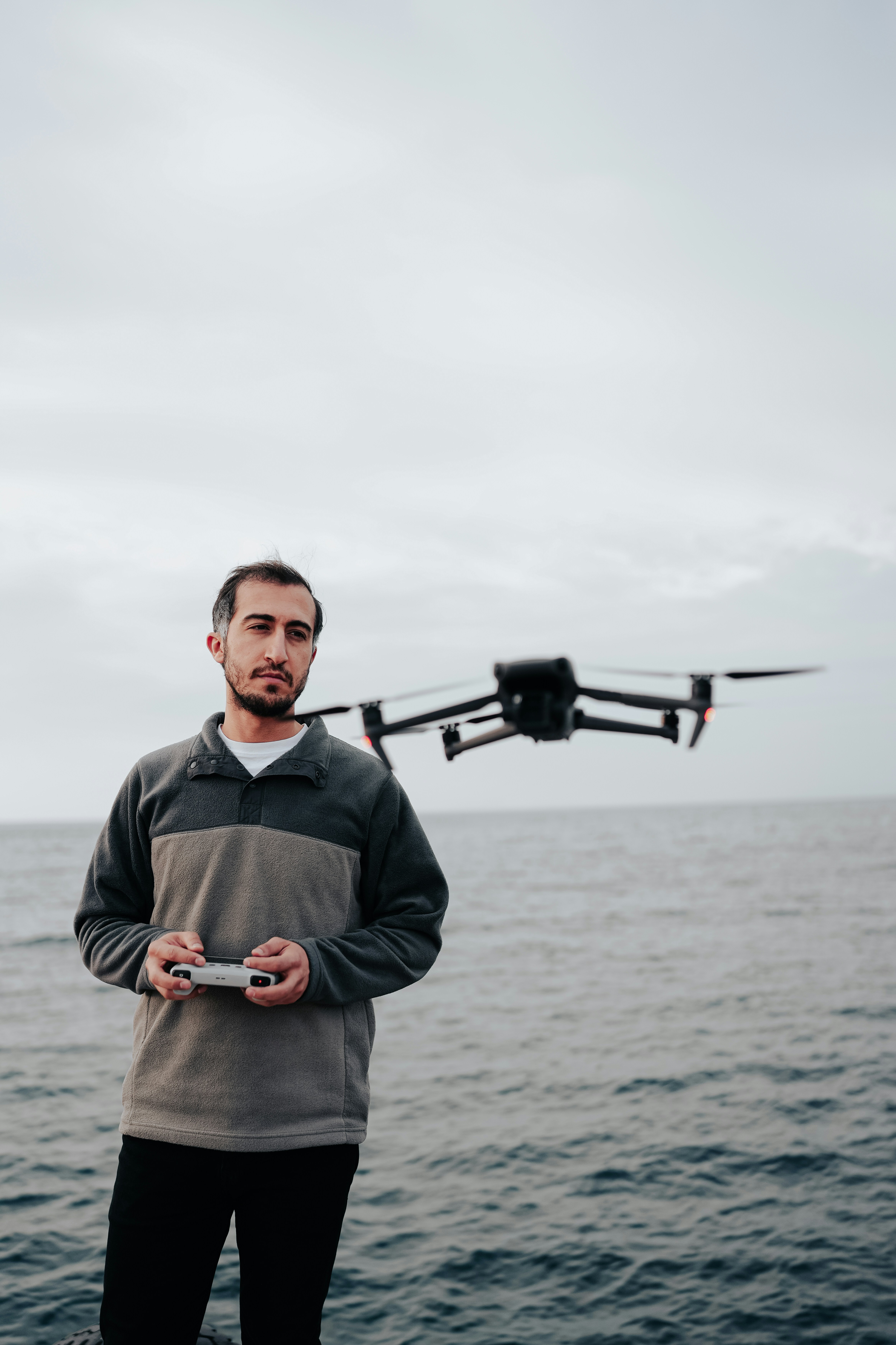 Drone Pilot at the Horizon: A Quiet Moment by the Sea
