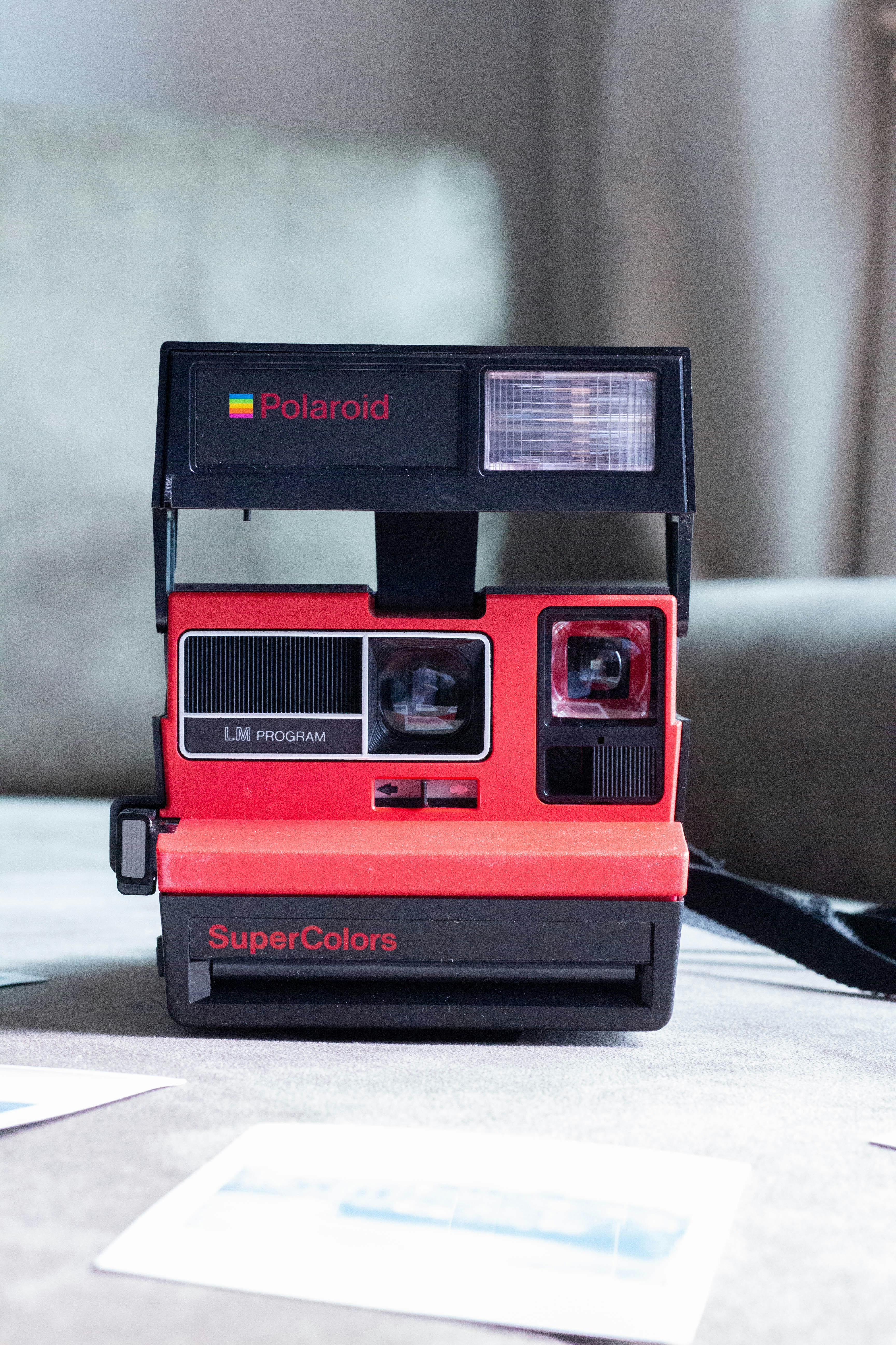 A polaroid camera sitting on top of a table photo – Free Camera Image ...