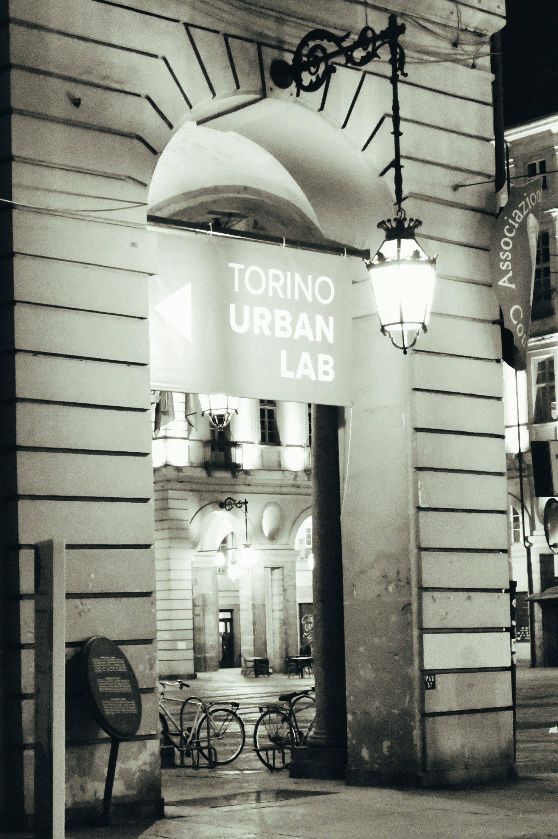 Night Arc: Torino Urban Lab Gate Bathed in Soft Streetlight
