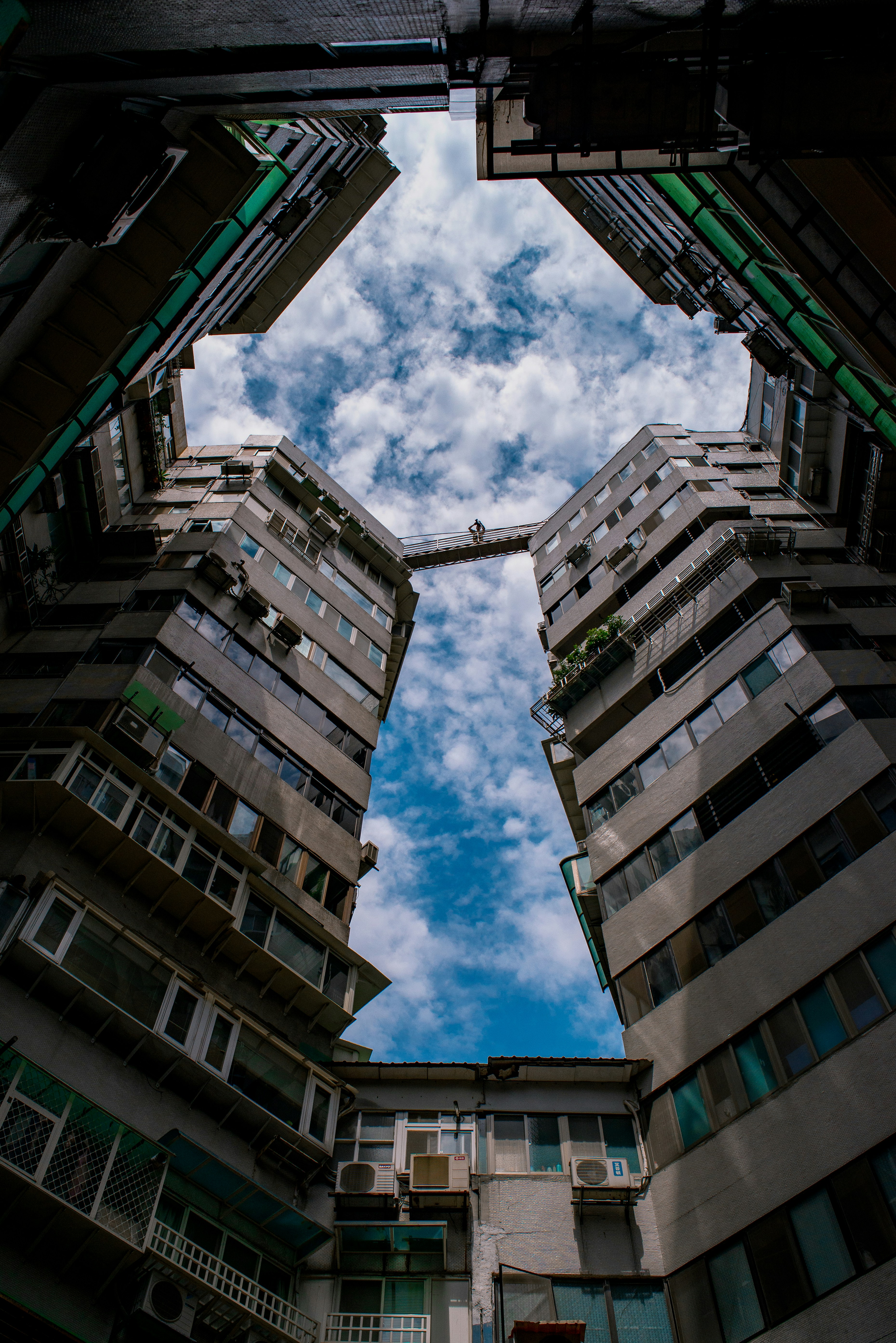 Looking up at tall buildings from the ground photo – Free Building ...