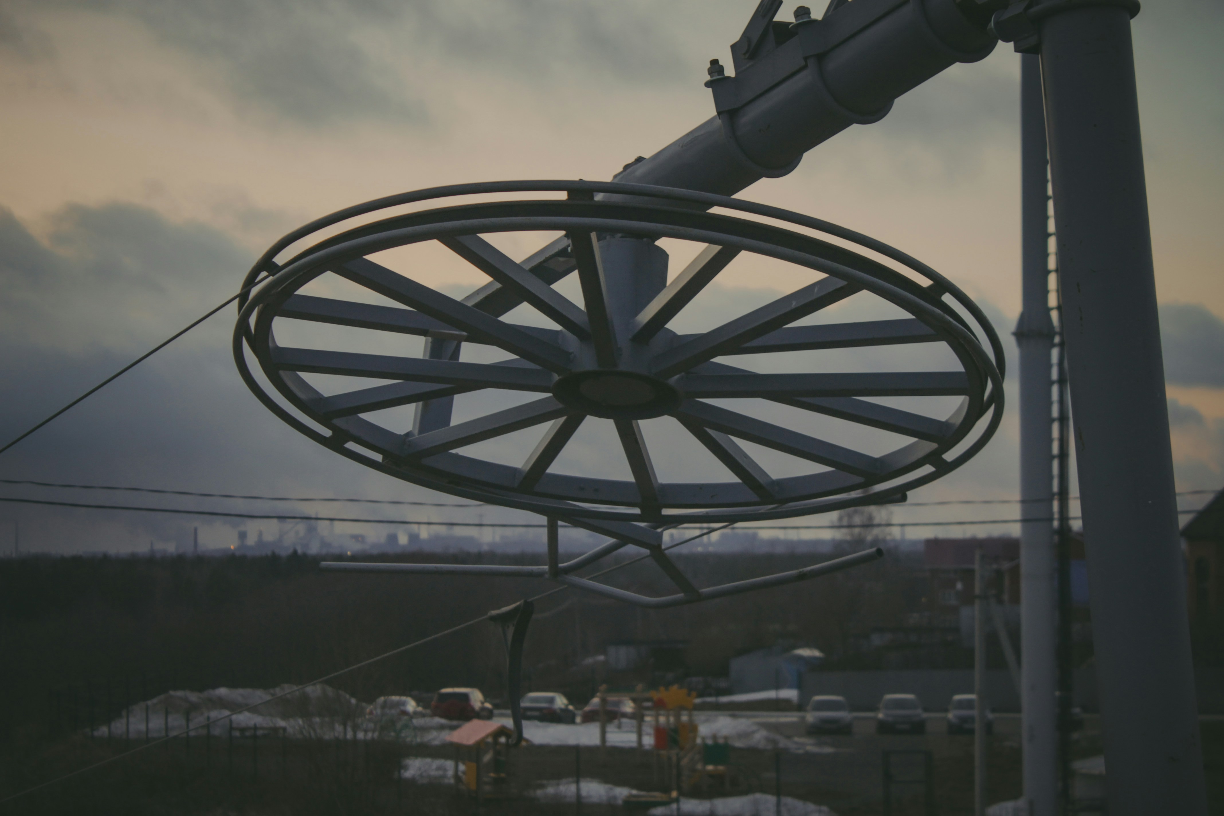a large metal object hanging from the side of a building