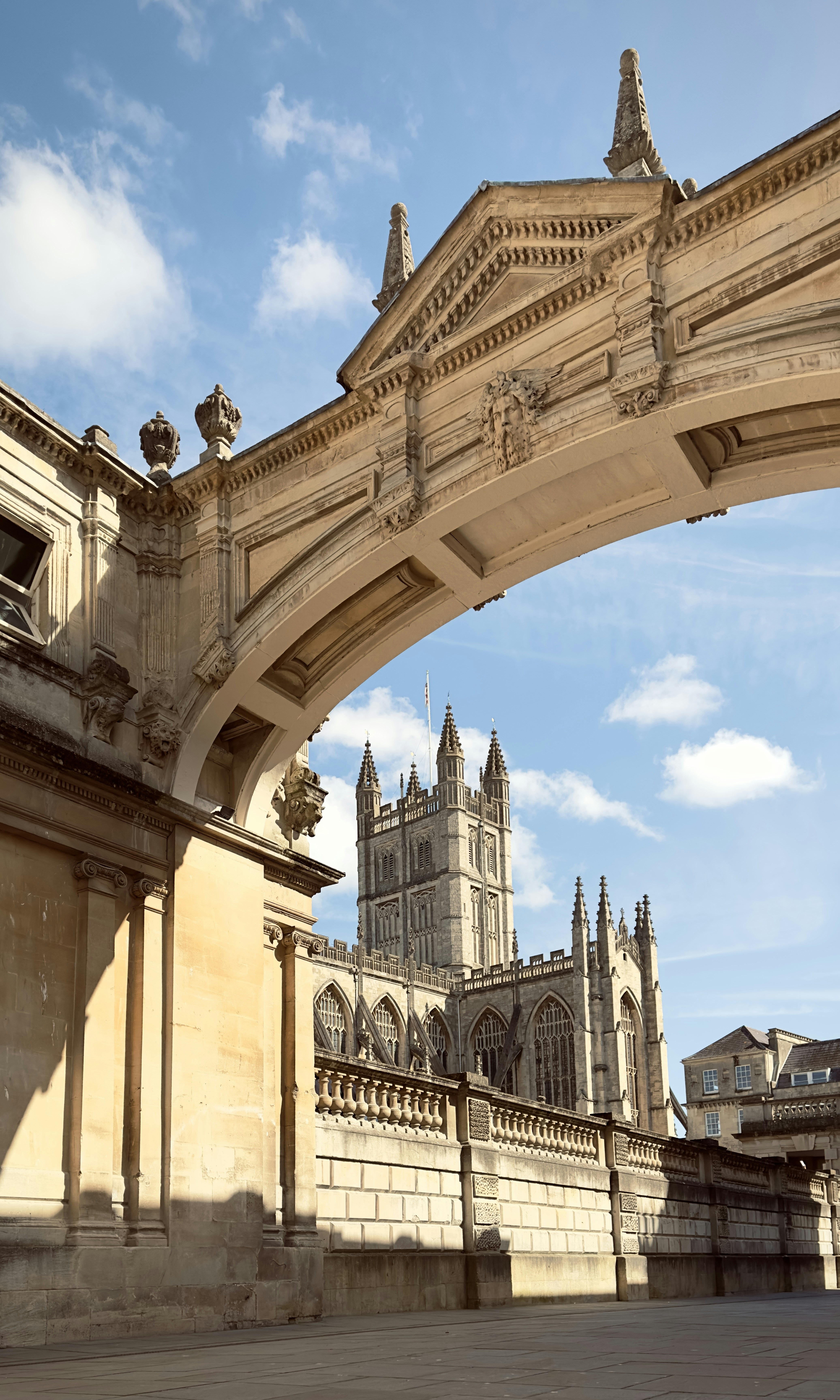 Under the Arch, a Gothic Cathedral Rises into a Clear Sky