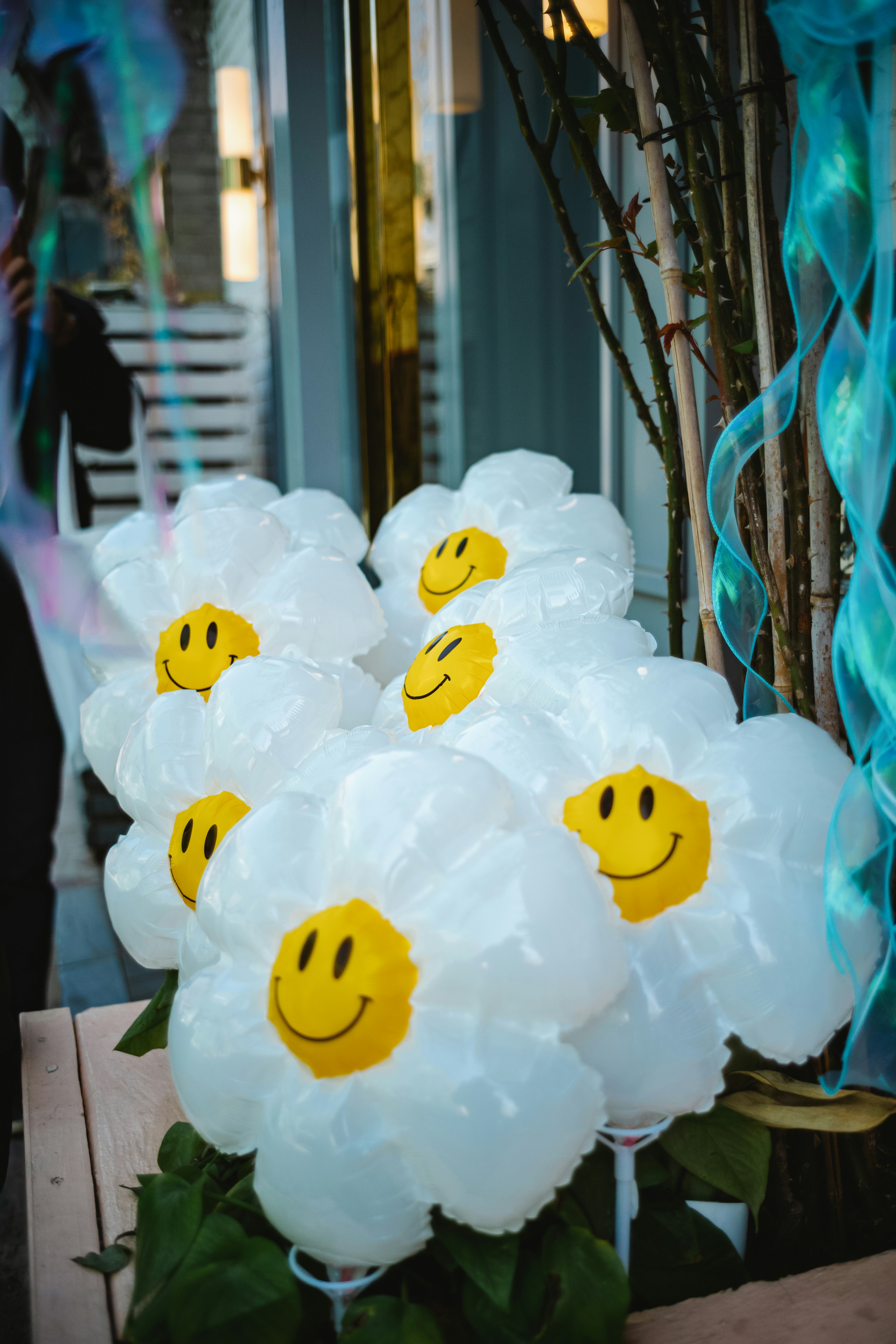 a bunch of balloons with smiley faces on them