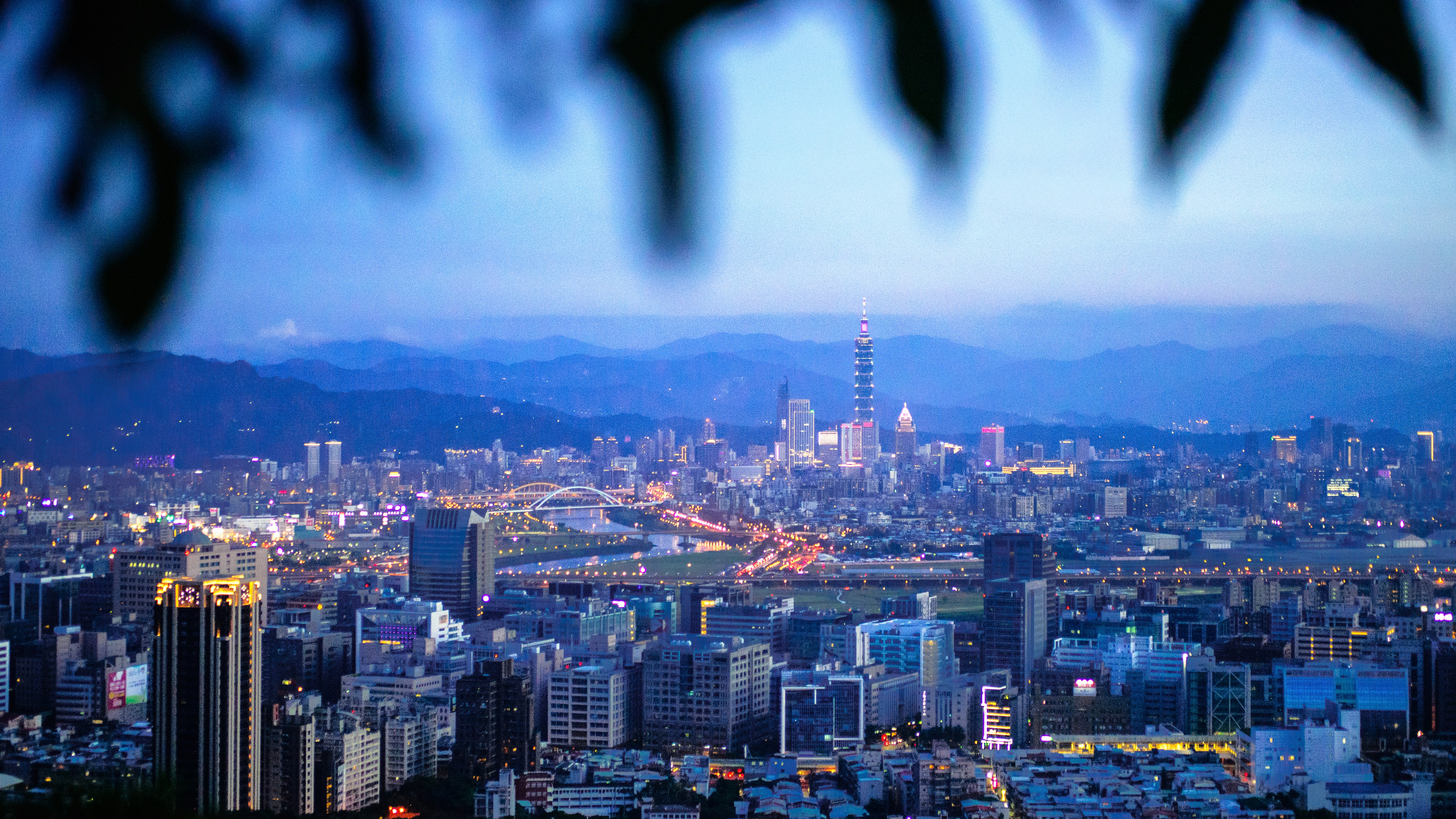 A view of a city at night from a distance photo – Free Cityscape Image ...