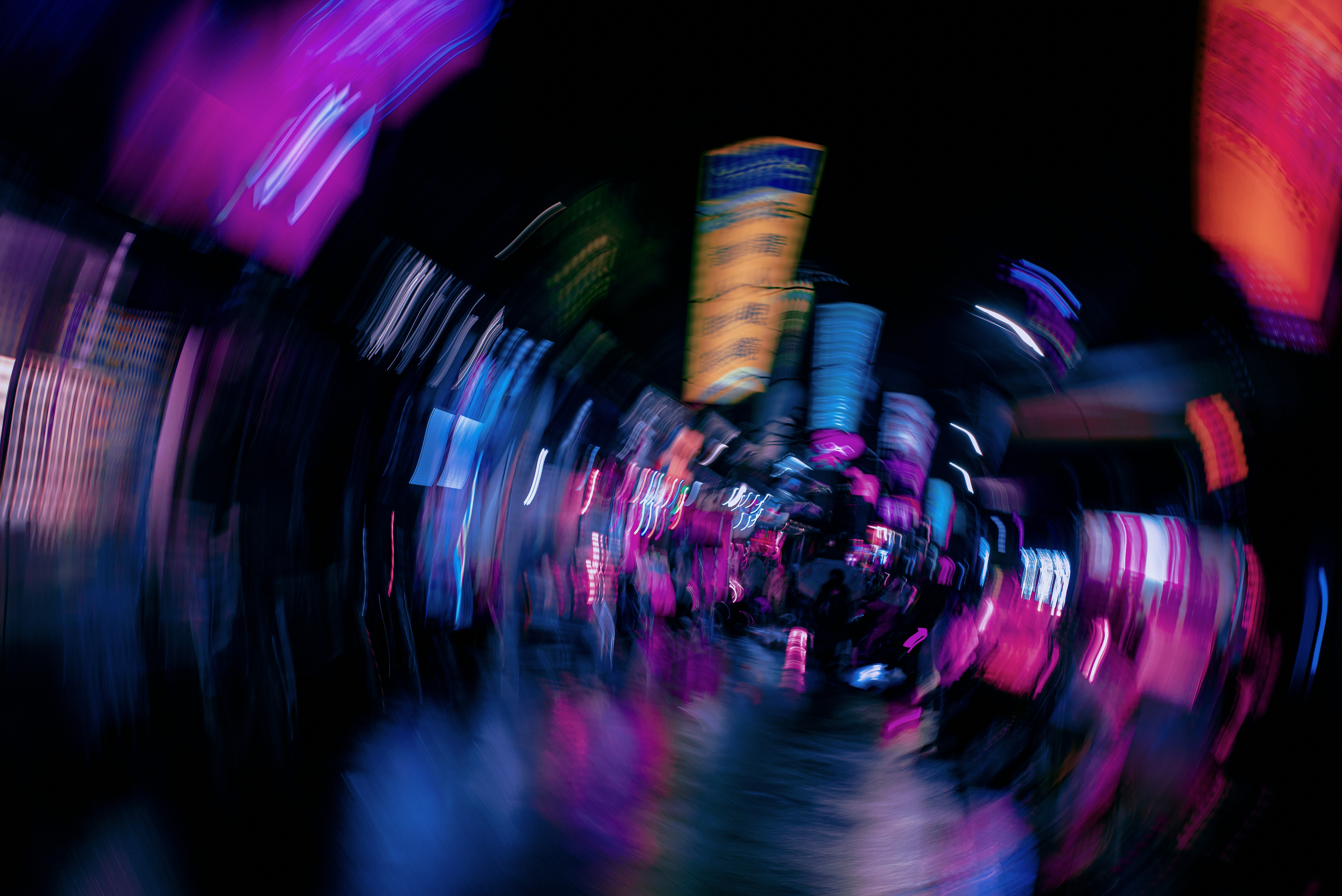 A blurry photo of a carnival ride at night photo – Free City Image on ...
