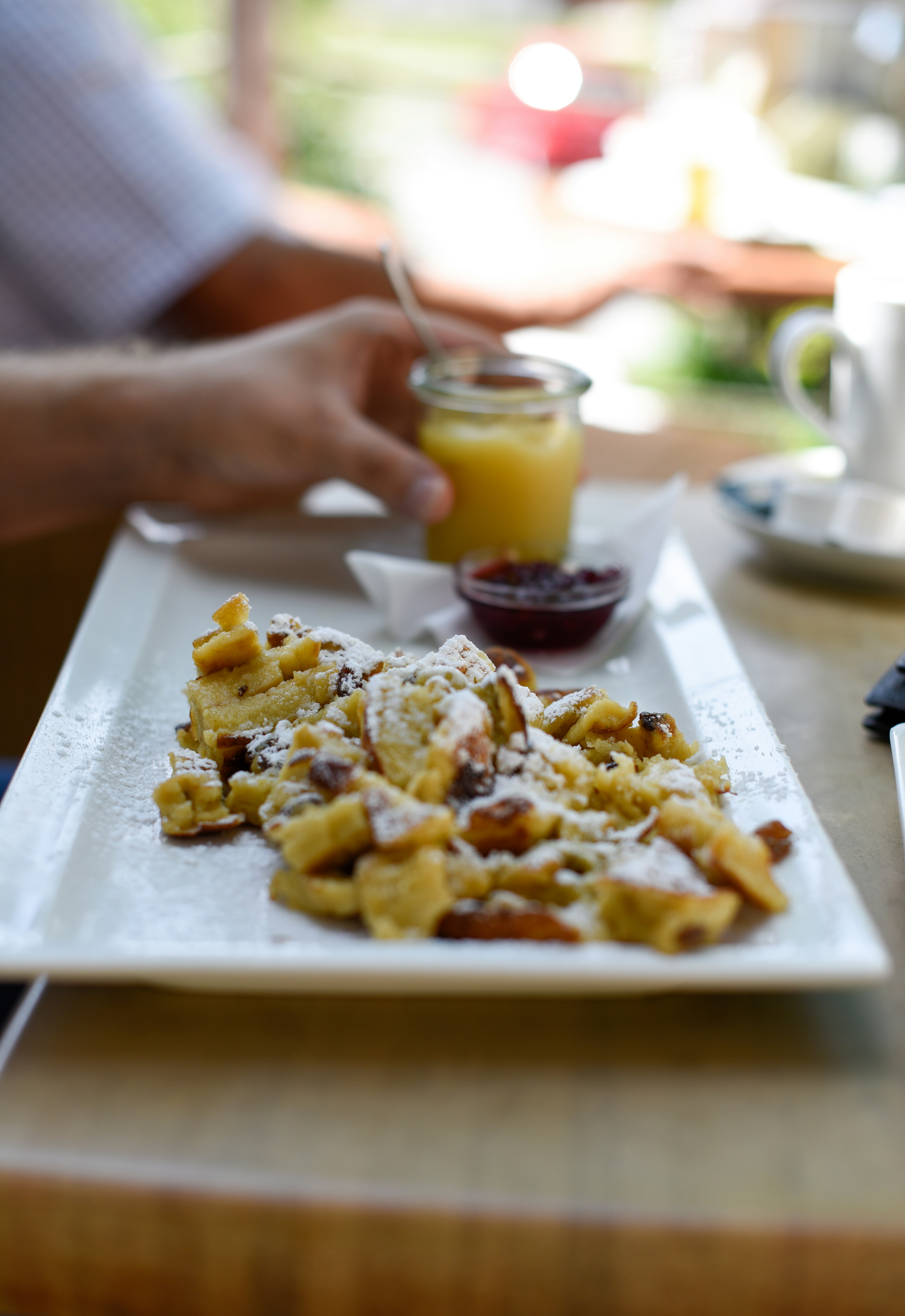Sunlit Café Plate: Powdered-Sugar Waffles with Jam and Juice