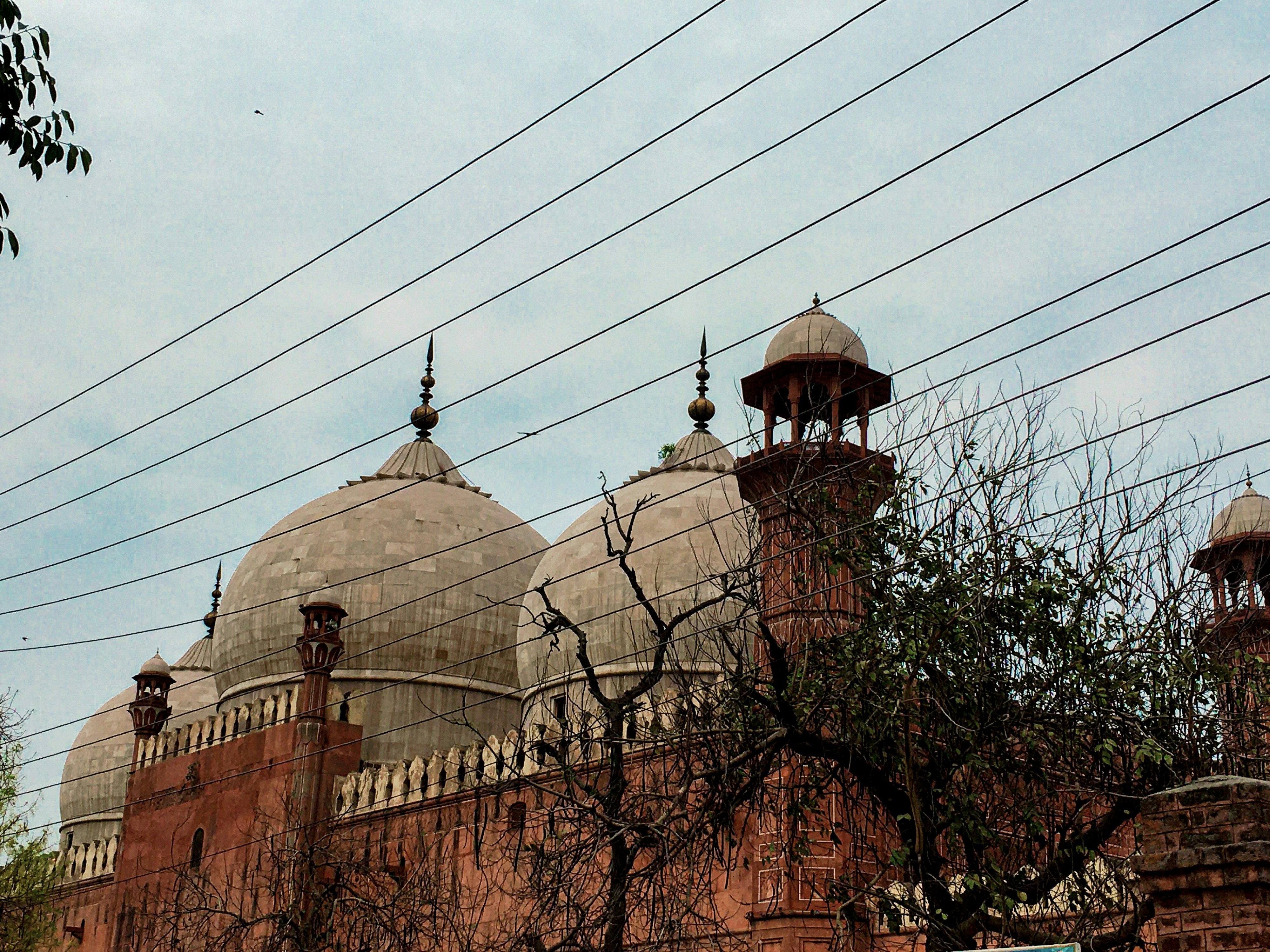 A large brick building with a clock tower photo – Free Lahore Image on ...