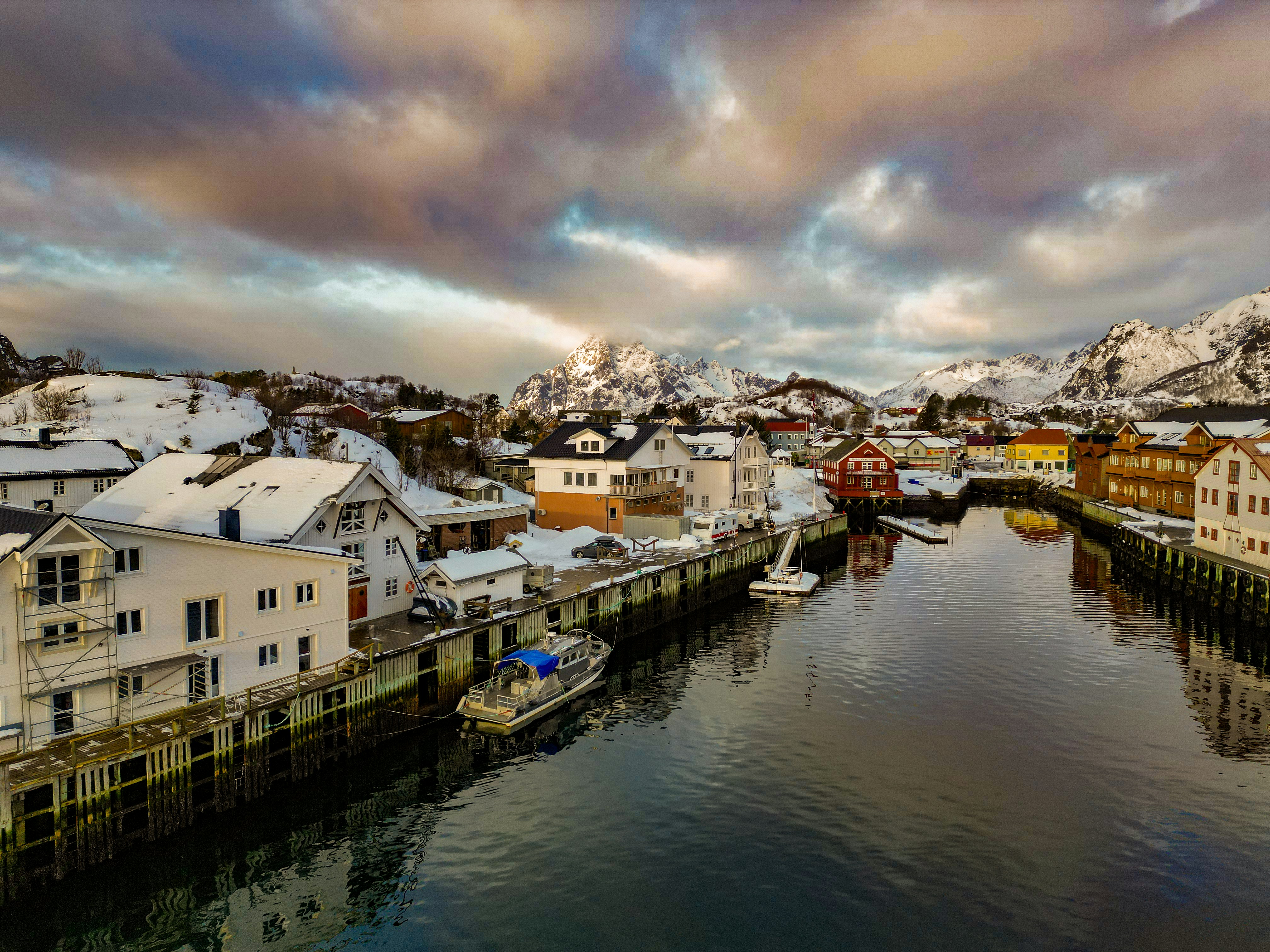Snowbound Canal: A Nordic Harbor Framed by Icy Peaks