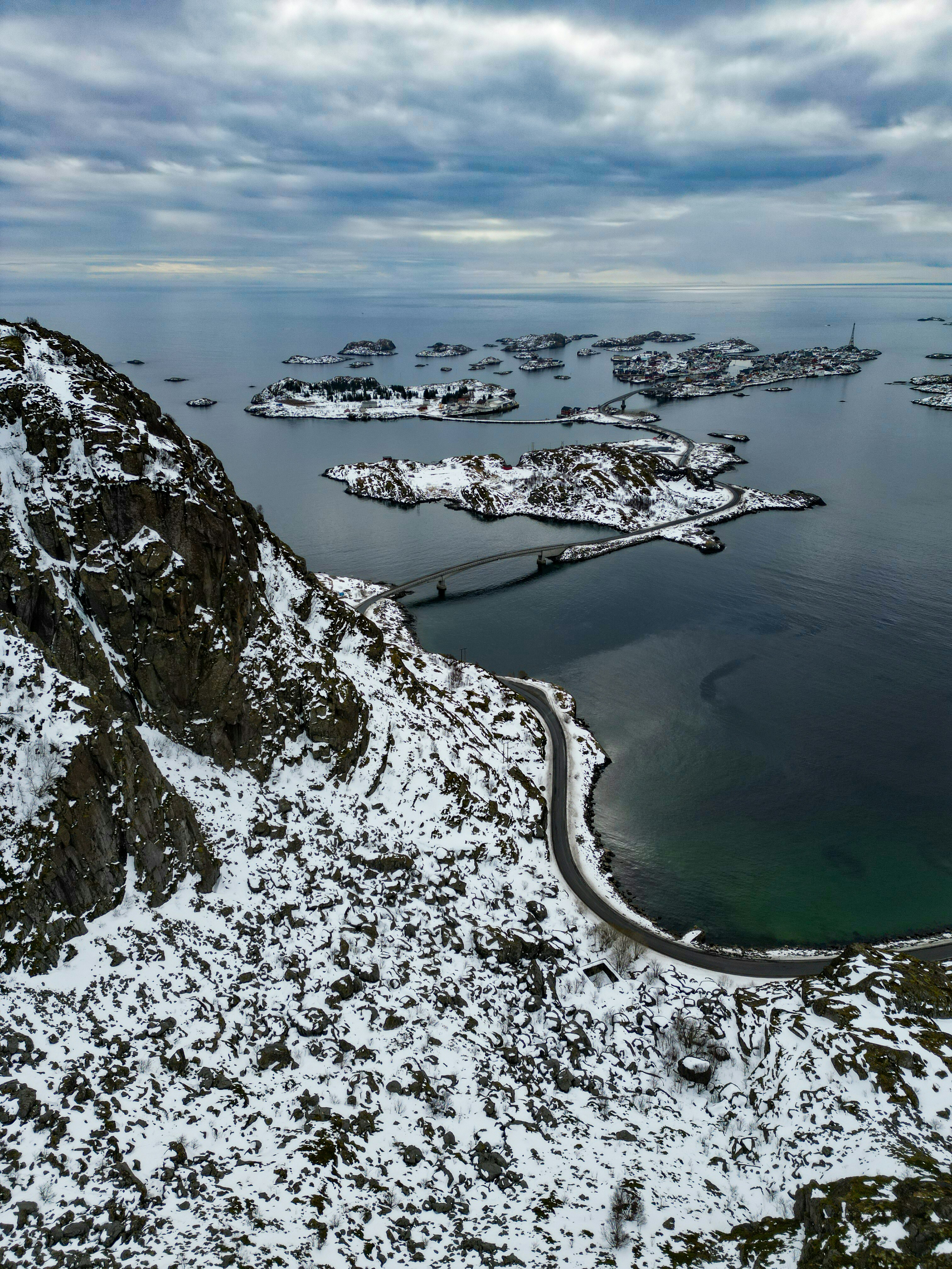 Snowbound Serpentine Road Over an Archipelago of Icy Islets