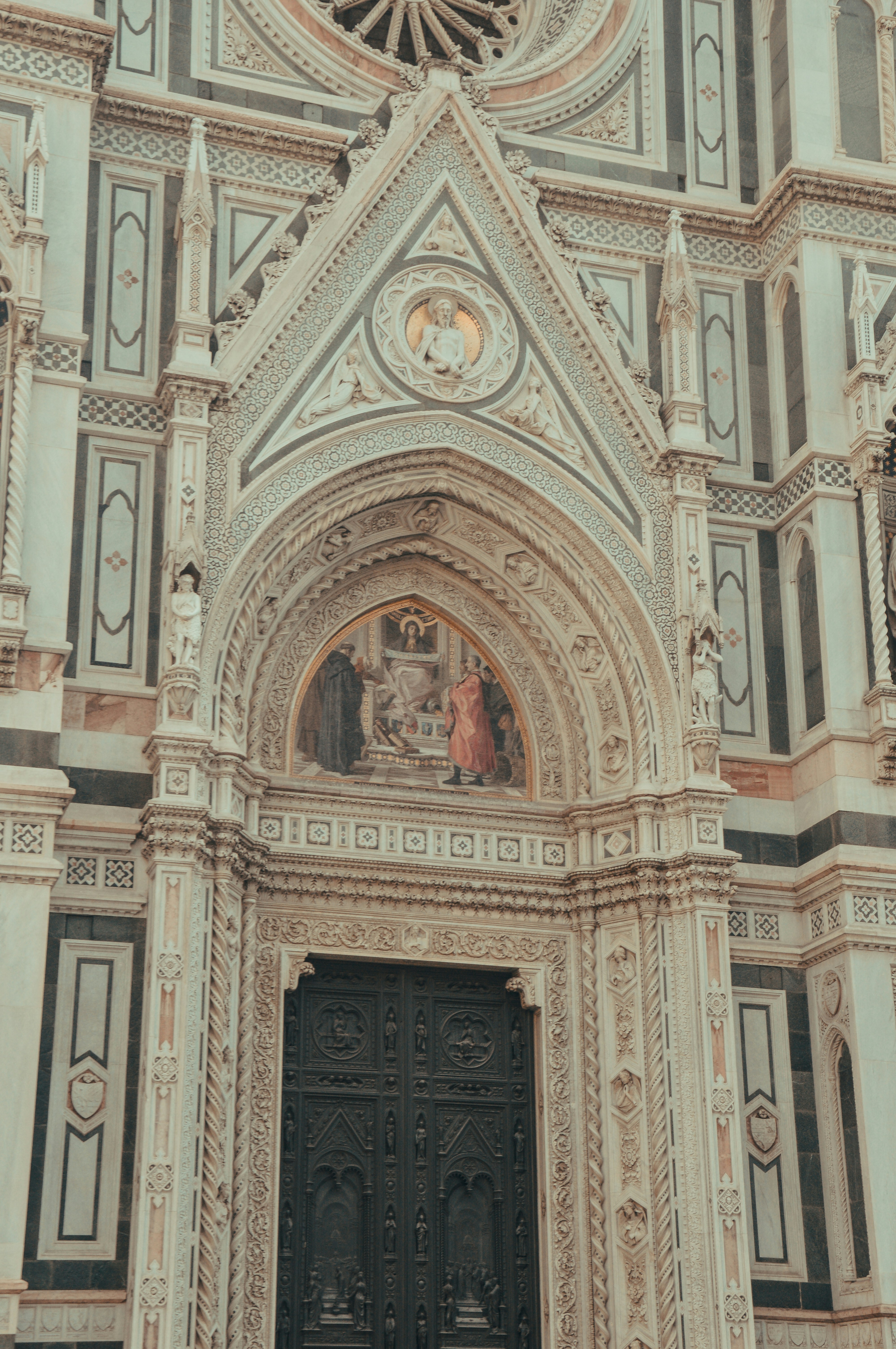a large ornate building with a clock on it's side