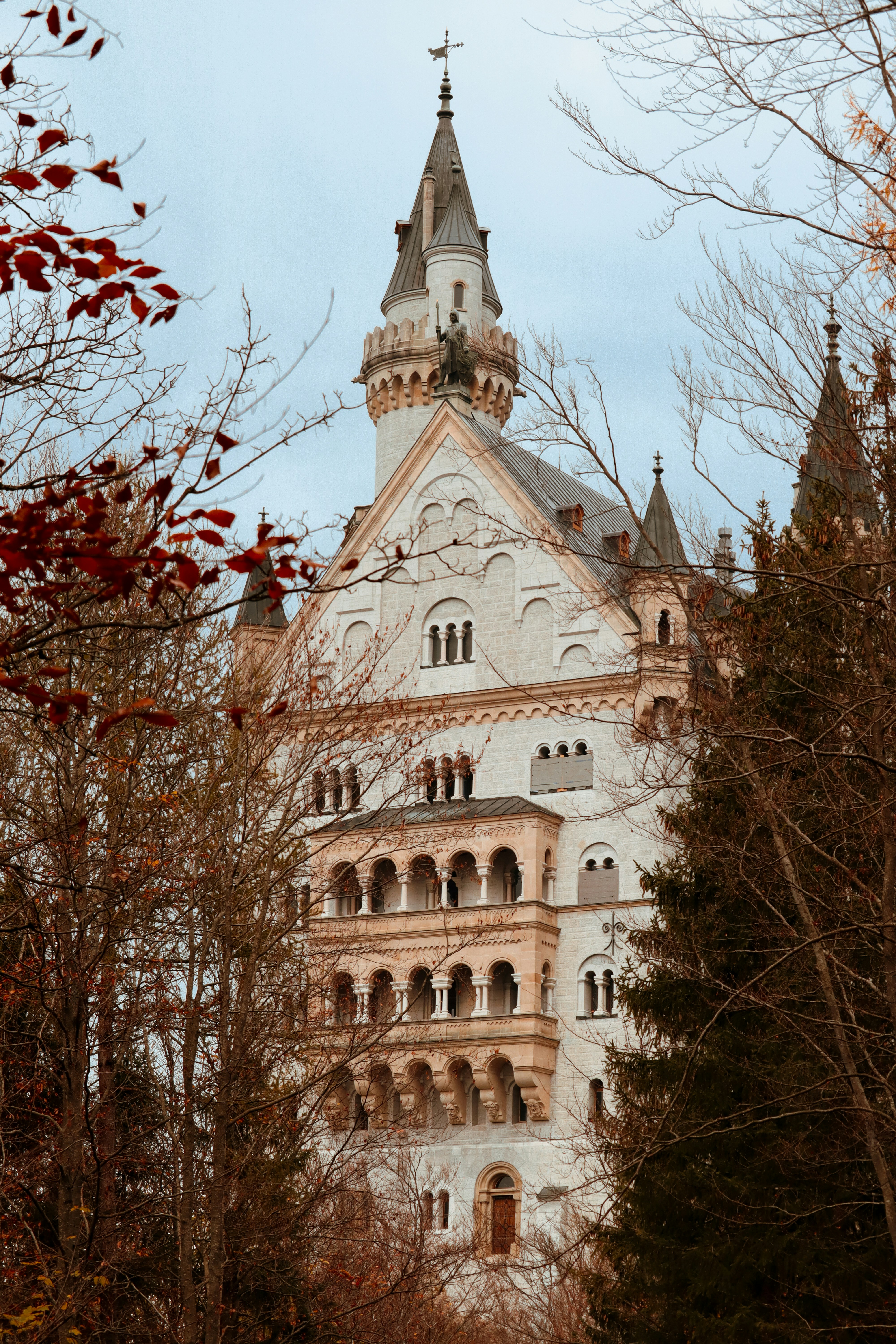 A tall building with a clock on the top of it photo – Free ...
