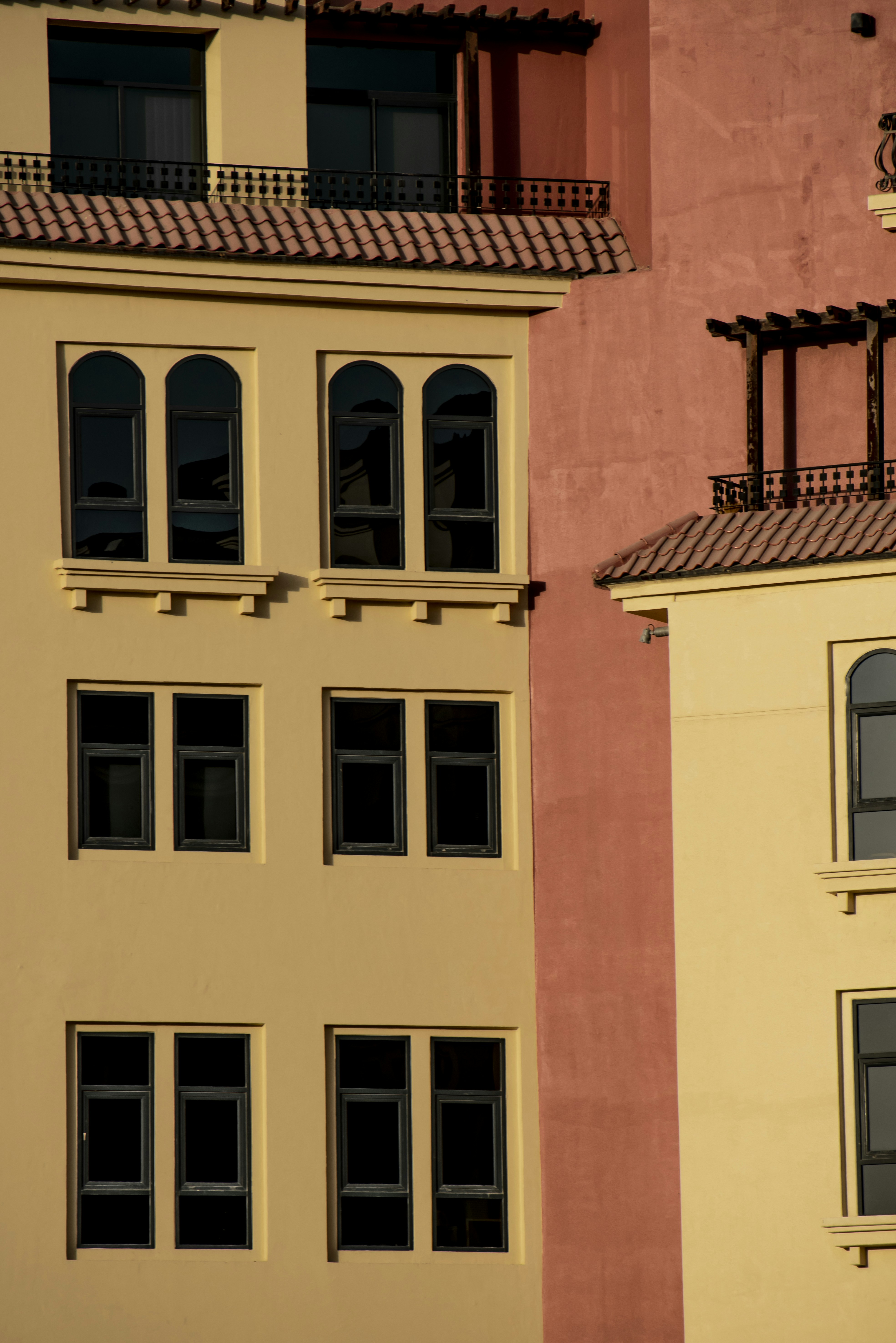 a clock on a pole in front of a building