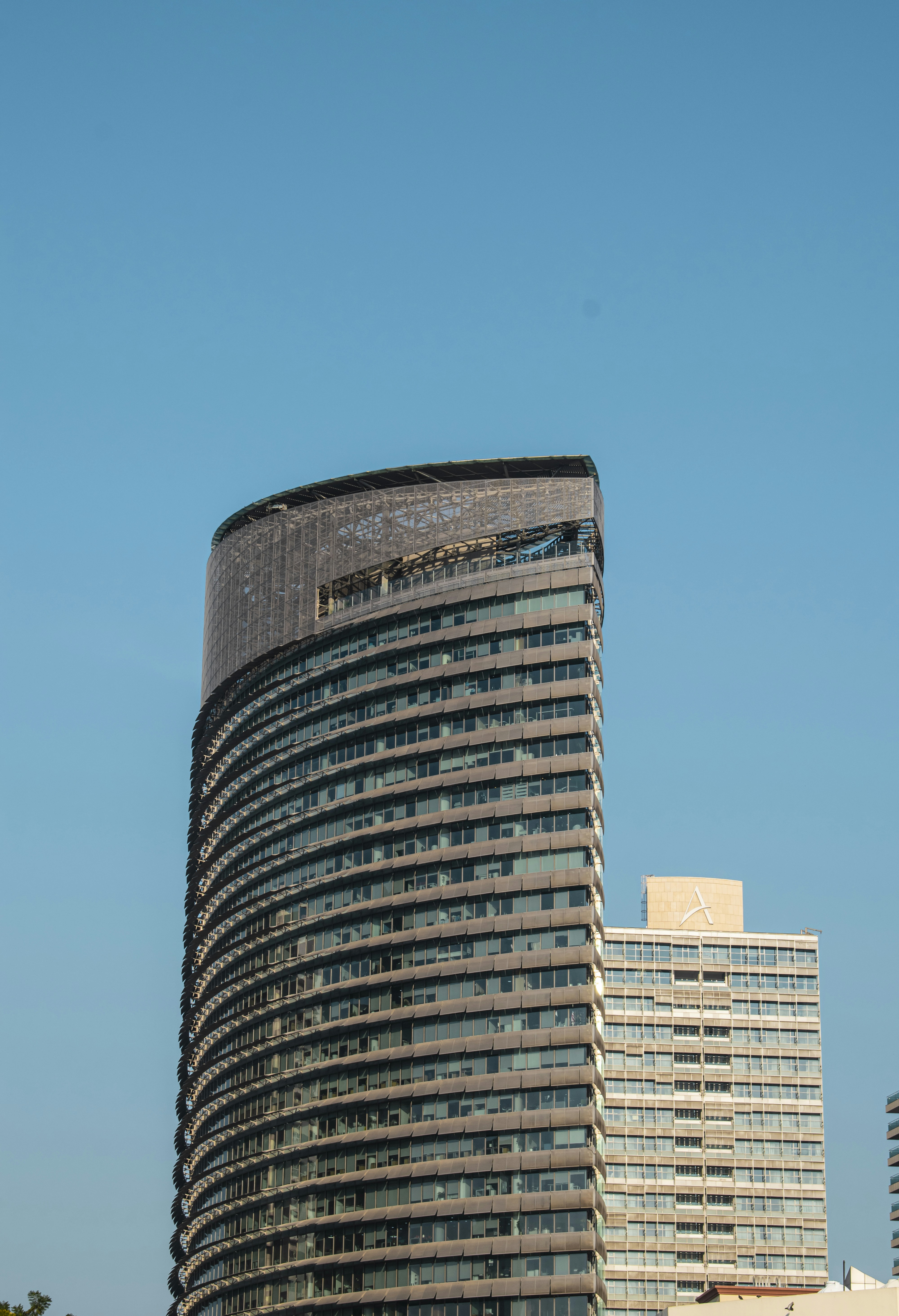 a very tall building sitting next to a very tall building