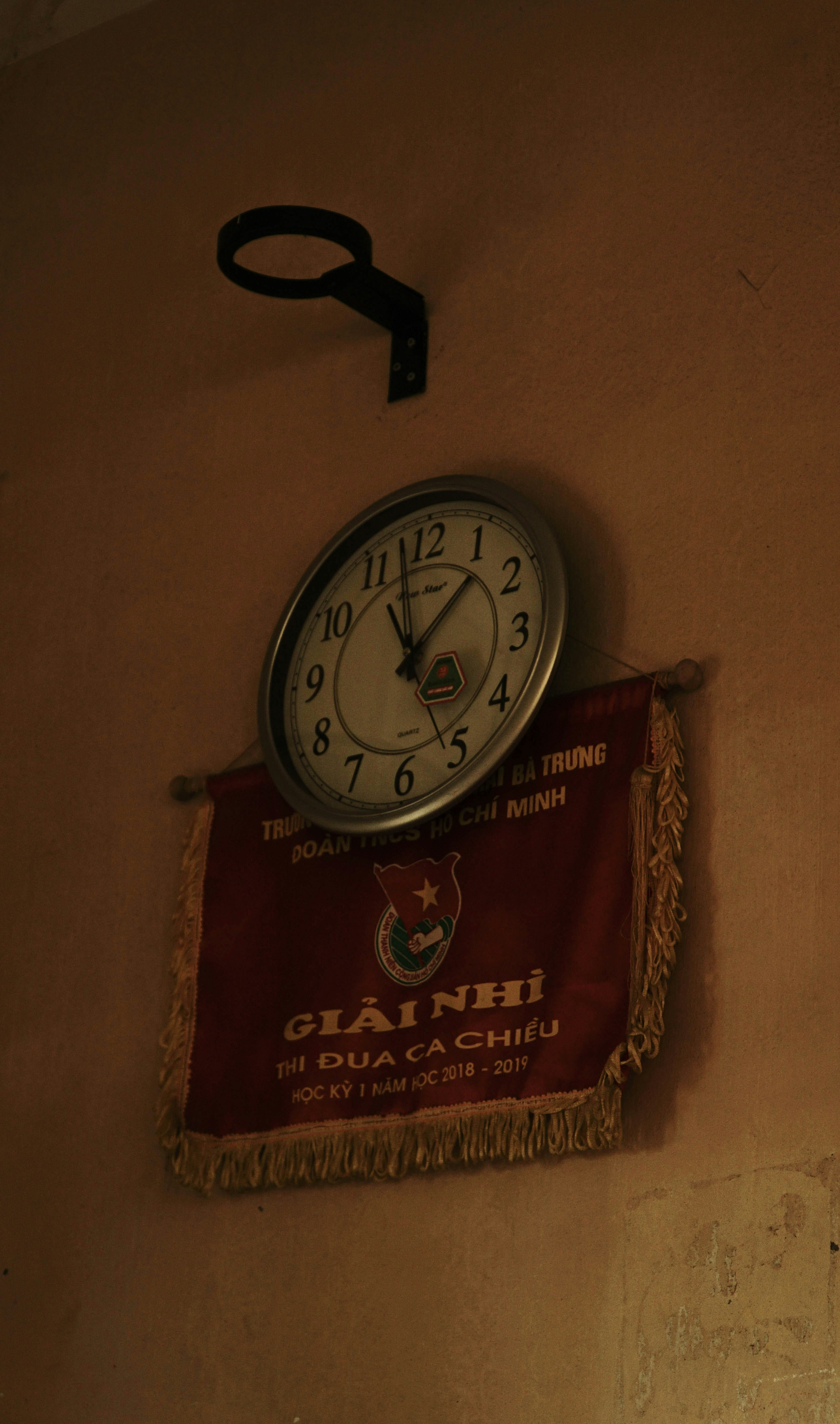 a clock mounted to the side of a wall