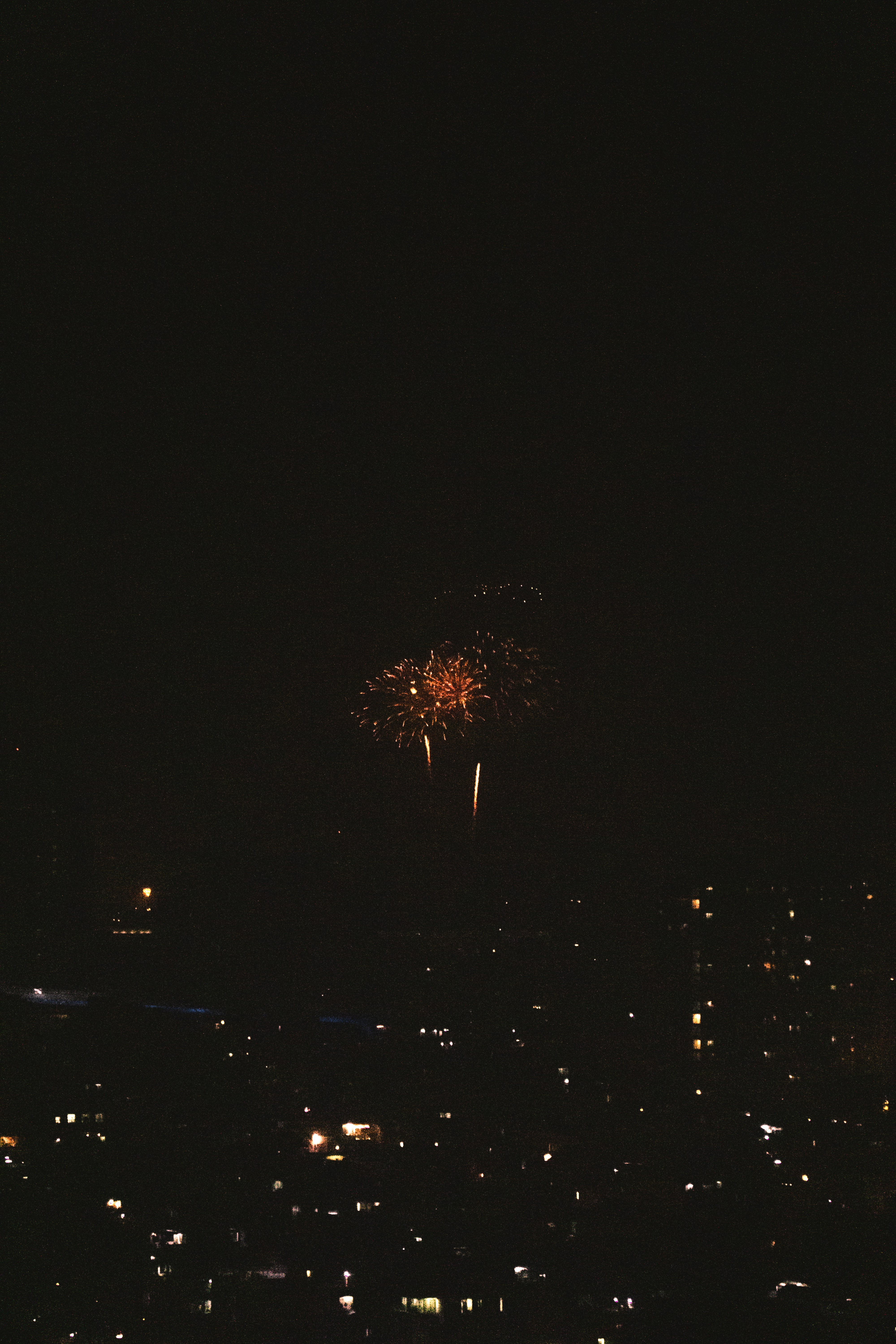 a view of a city at night with fireworks