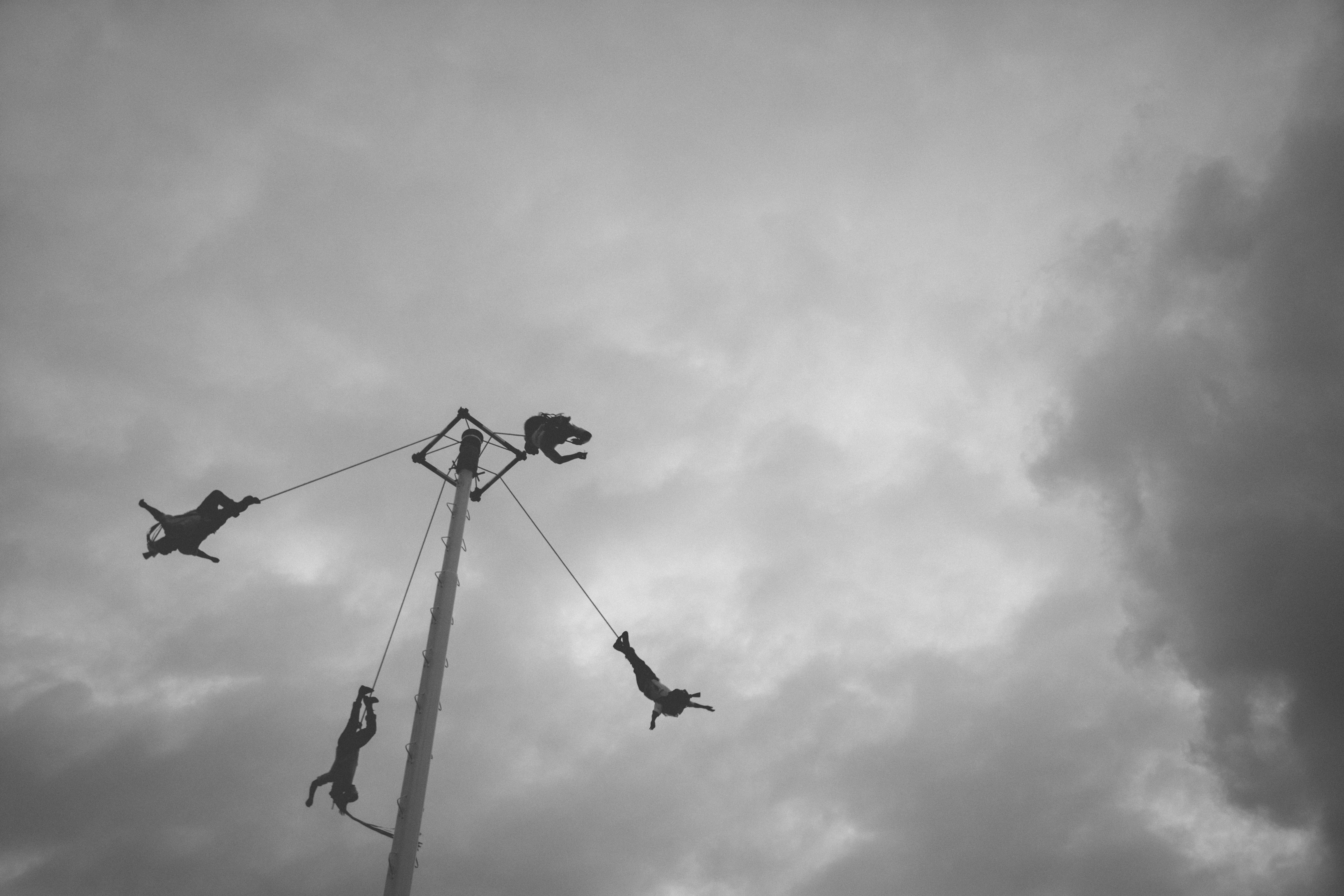 Dramatic High-Want: A Swing of Silhouettes Against Stormy Skies