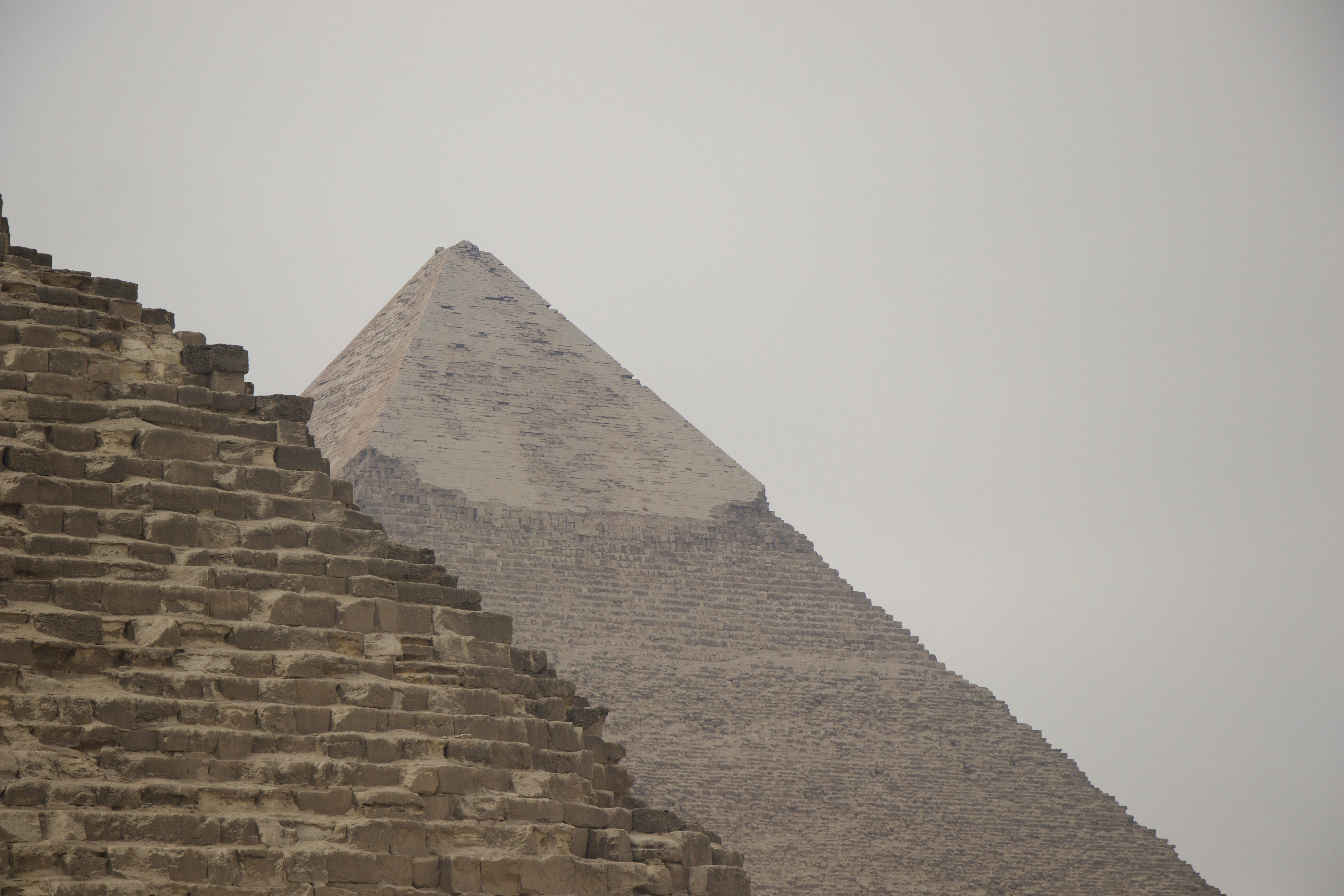 Two large pyramids in front of a cloudy sky photo – Free Giza Image on ...