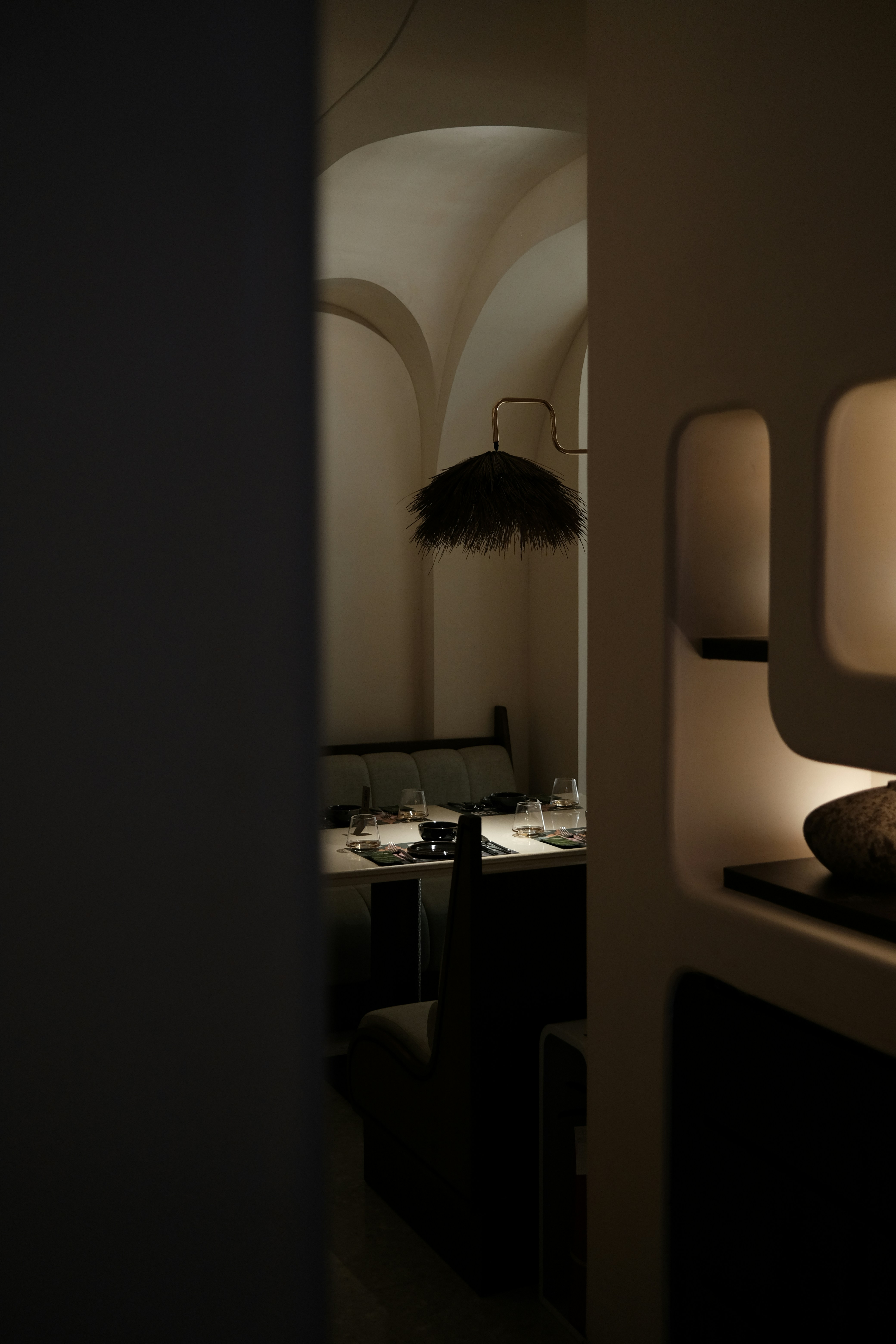 A dimly lit room with a table and chairs photo – Free Interior design ...