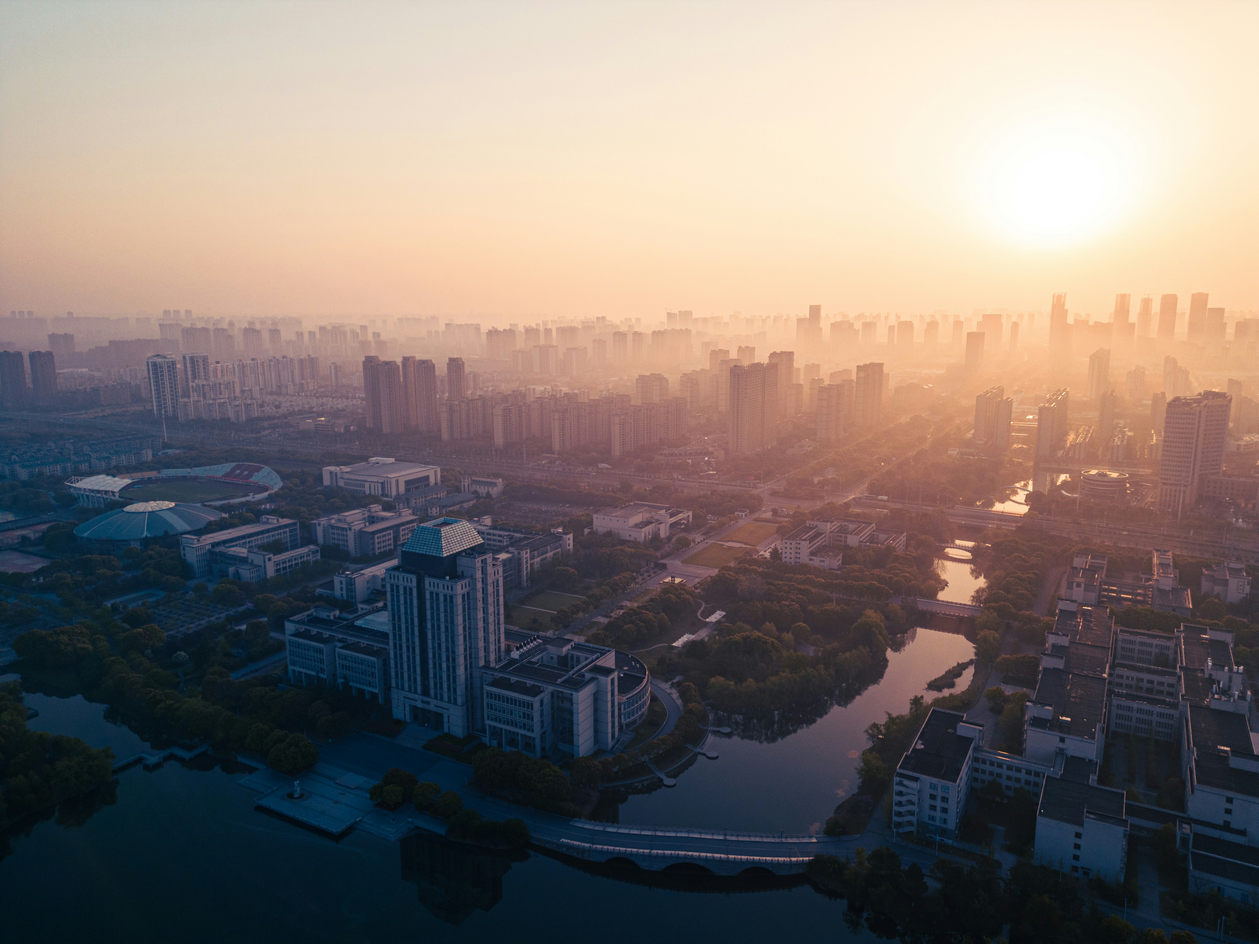 An aerial view of a city with a river running through it photo – Free ...
