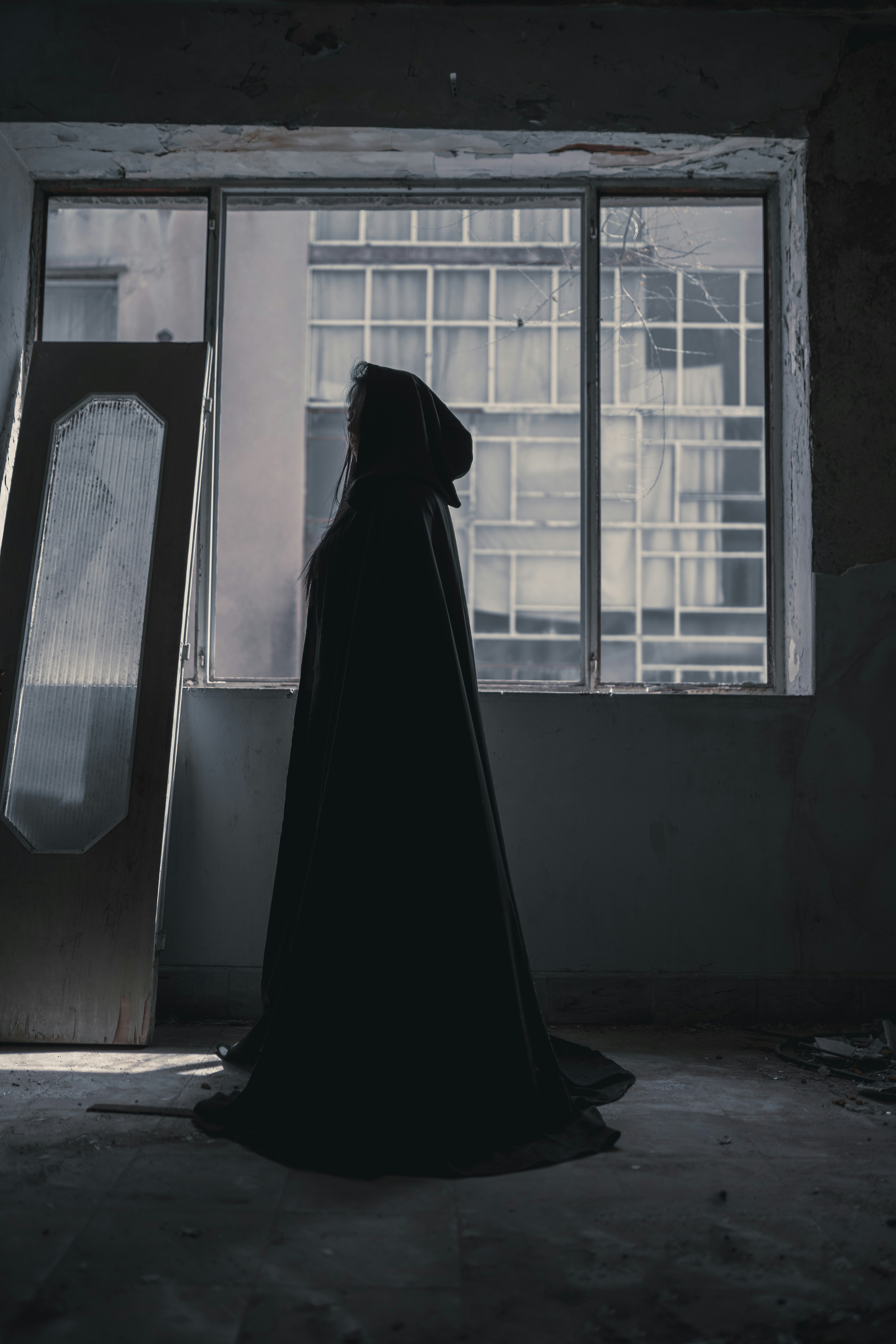 Cloaked Sentinel in a Crumbling Studio