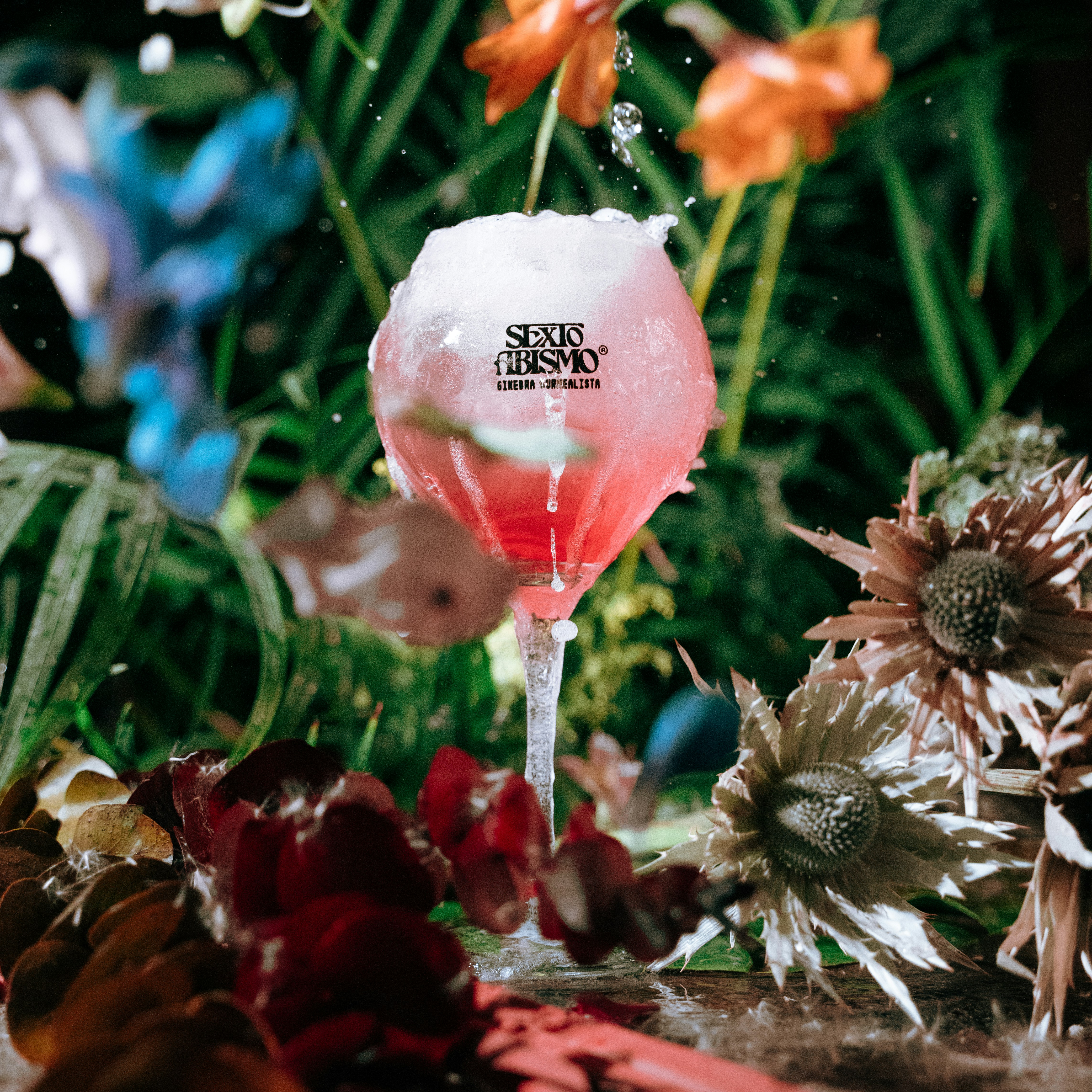 Frosted Bloom: Pink Stem Glass Amidst a Garden of Ochre and Indigo