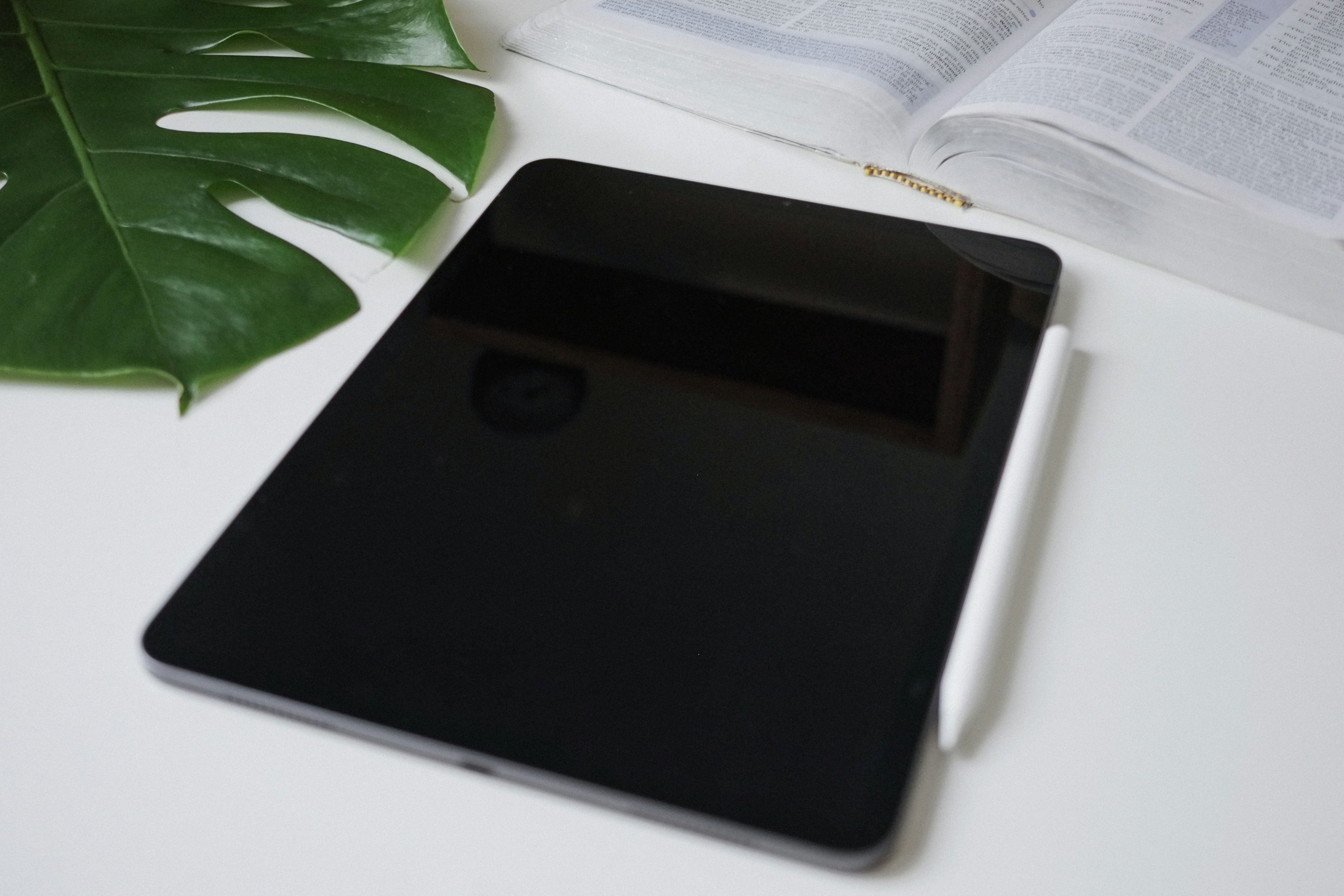 Black Tablet on White Desk: A Quiet Moment of Modern Minimalism