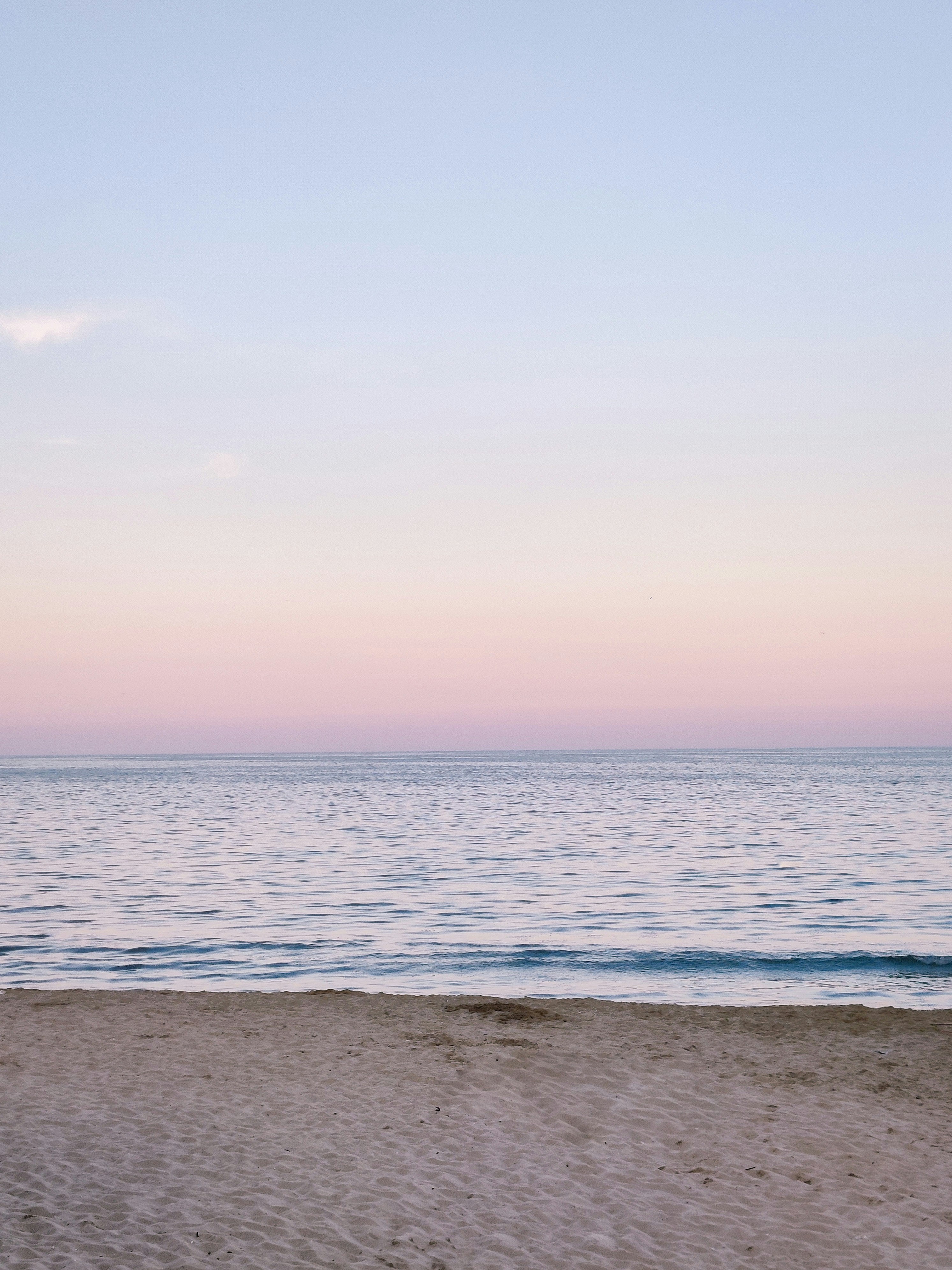 A person walking on a beach with a surfboard photo – Free Wallpaper 4k ...
